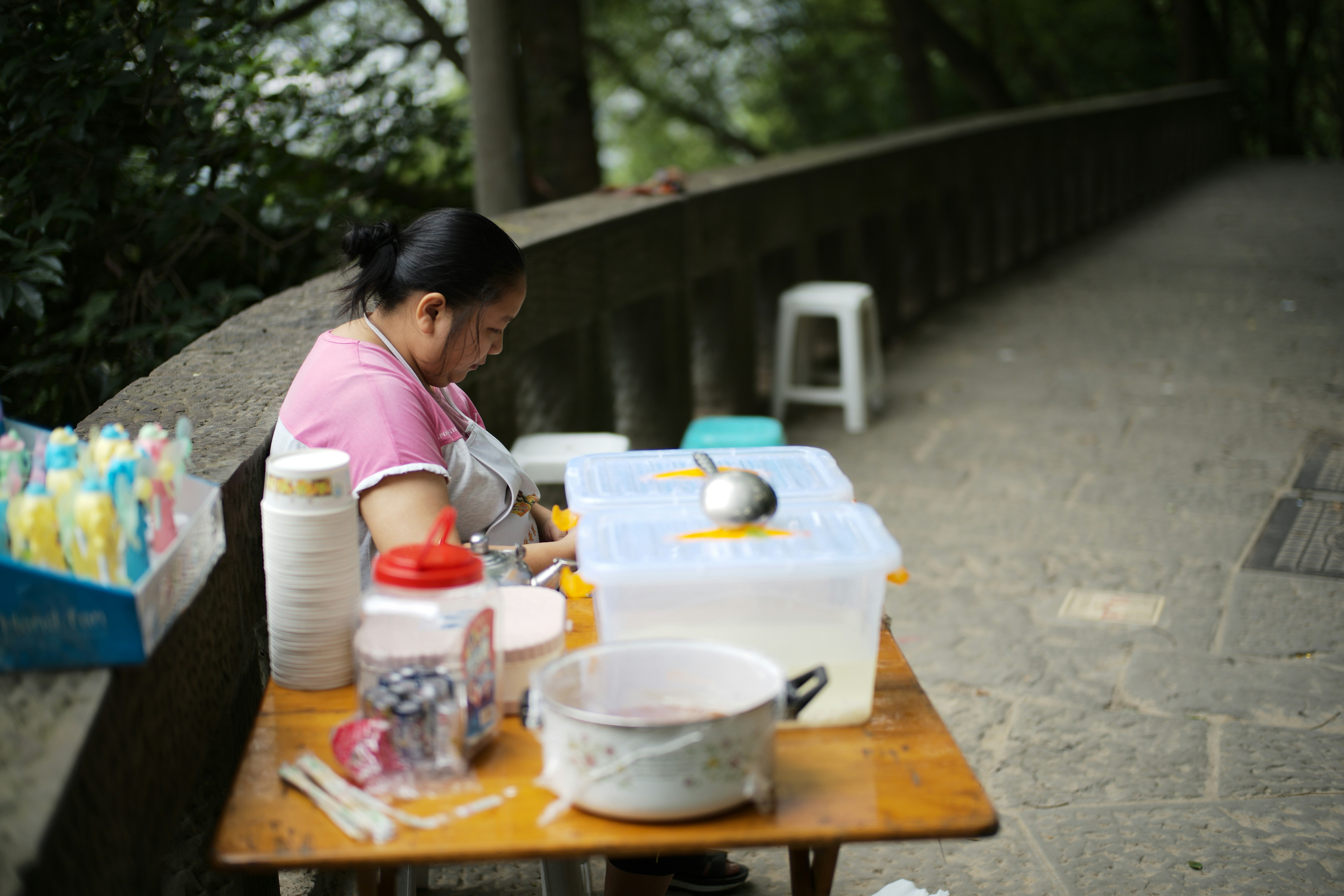 Sunlit Prep by the Path: A Quiet Street-Side Kitchen Moment