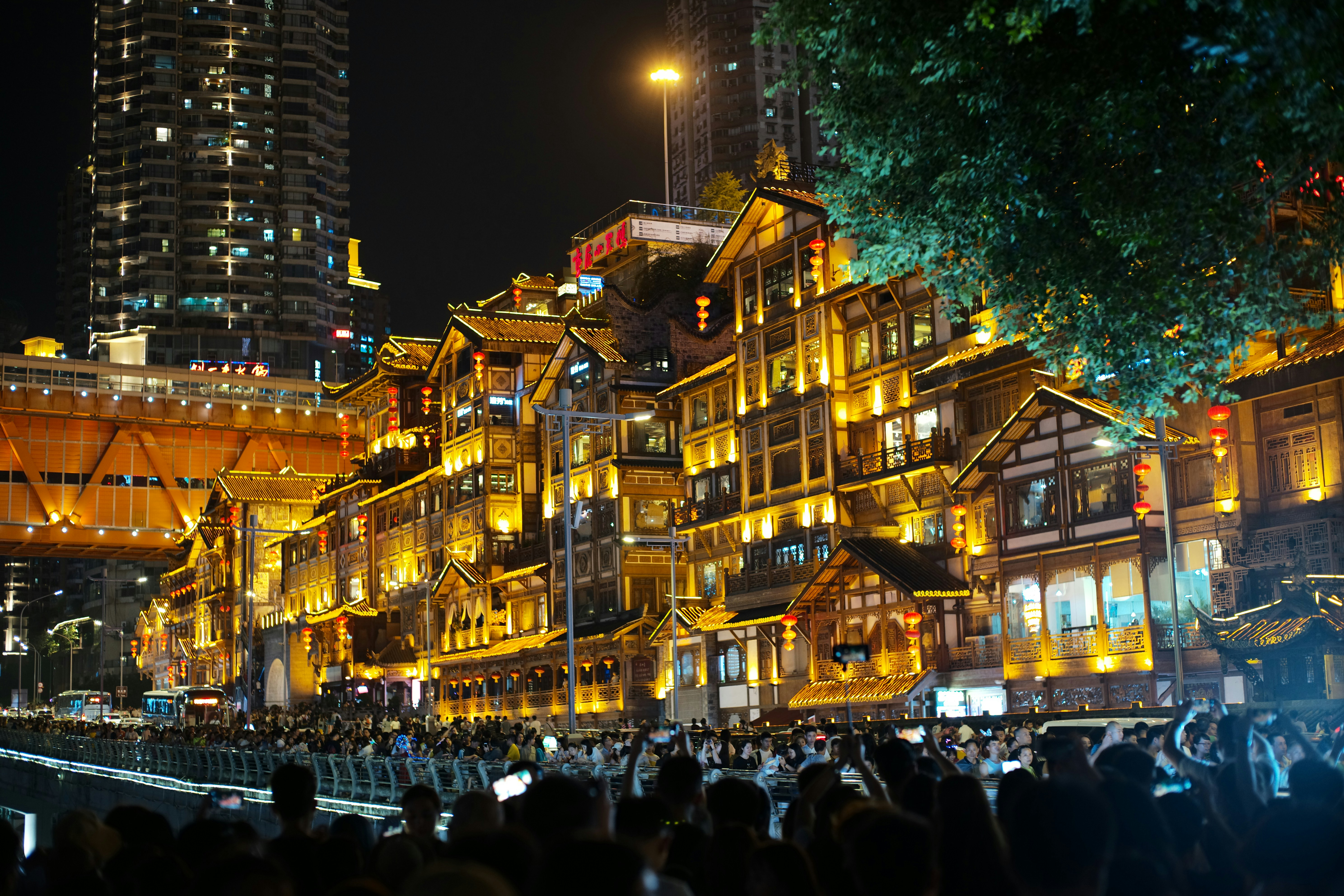 Golden Lanterns Over the Riverside Village: Night-lit Timber Rowhouses