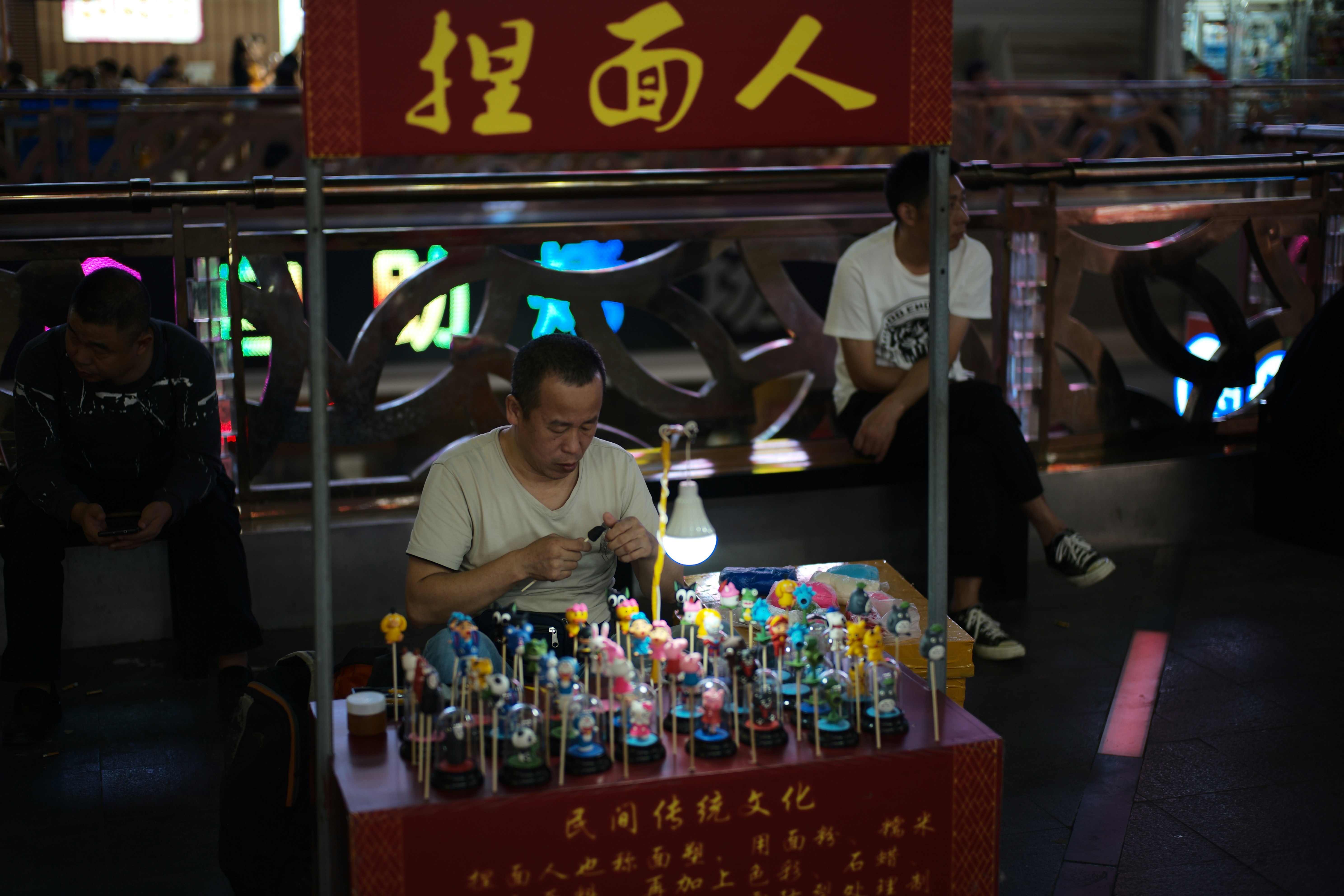 Figurine Artisan Under Neon Nightlight
