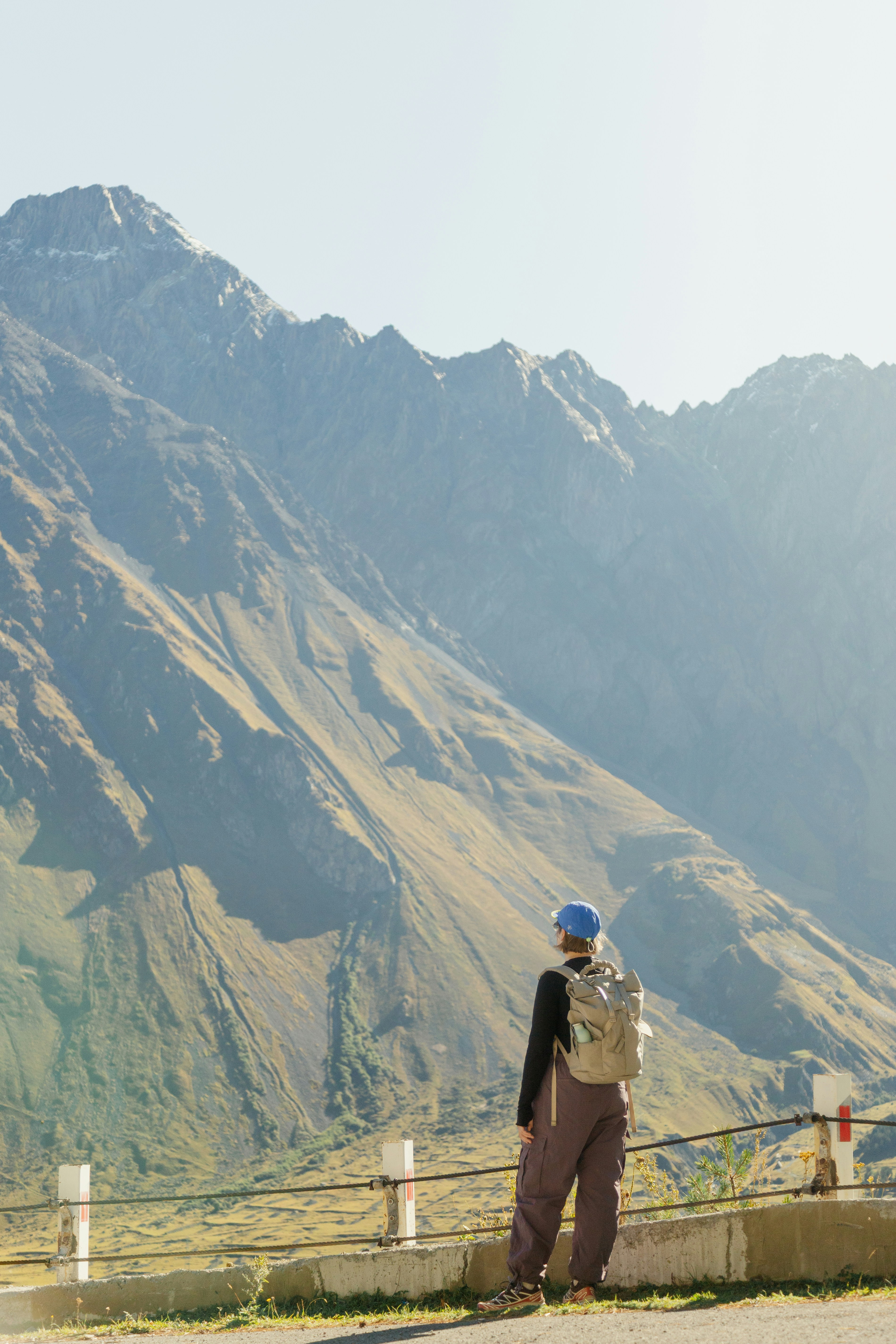 Trailbound: a hiker pauses to soak in jagged alpine silhouettes