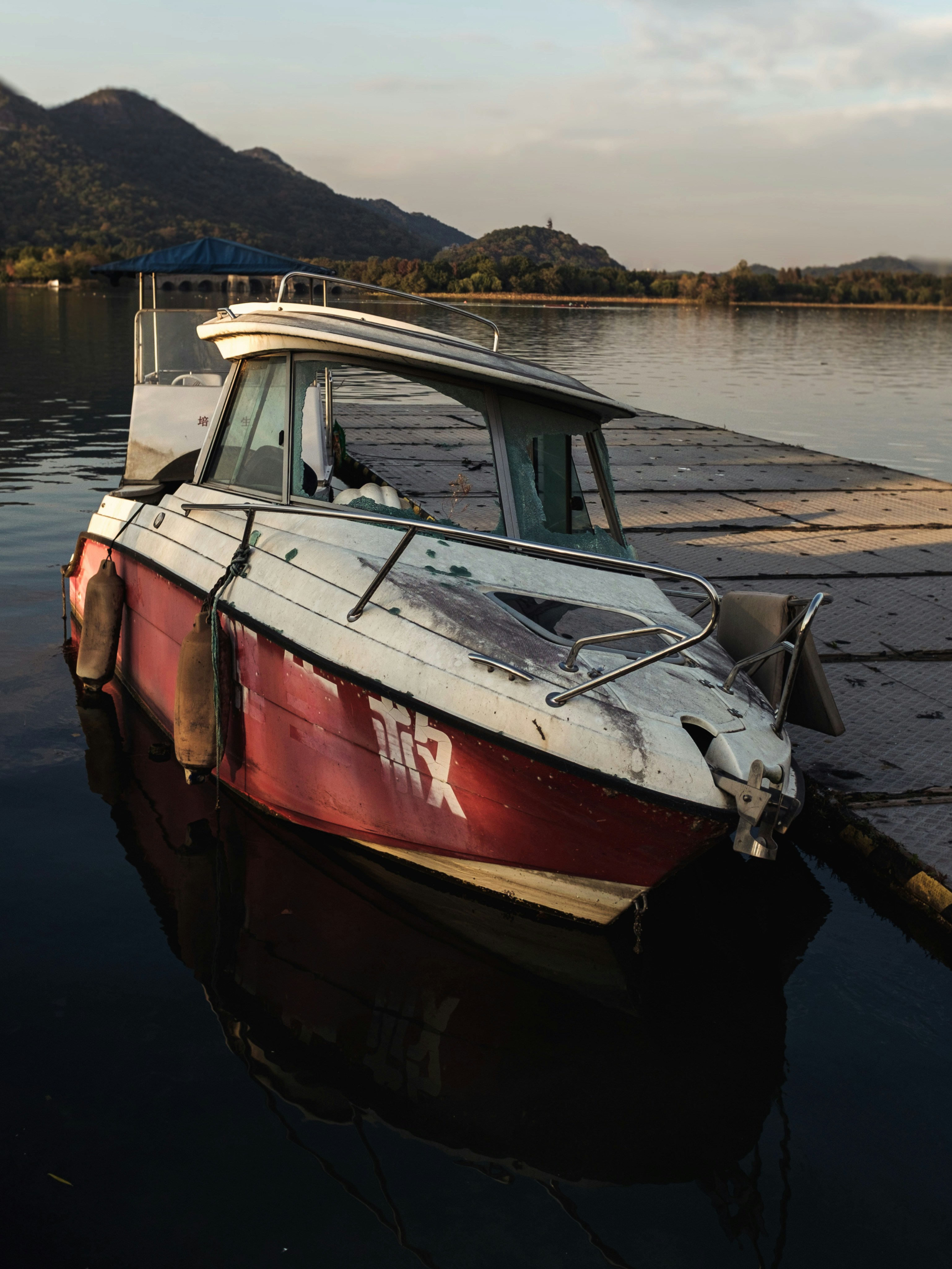Wharfside Quiet: A Weathered Boat at Dusk