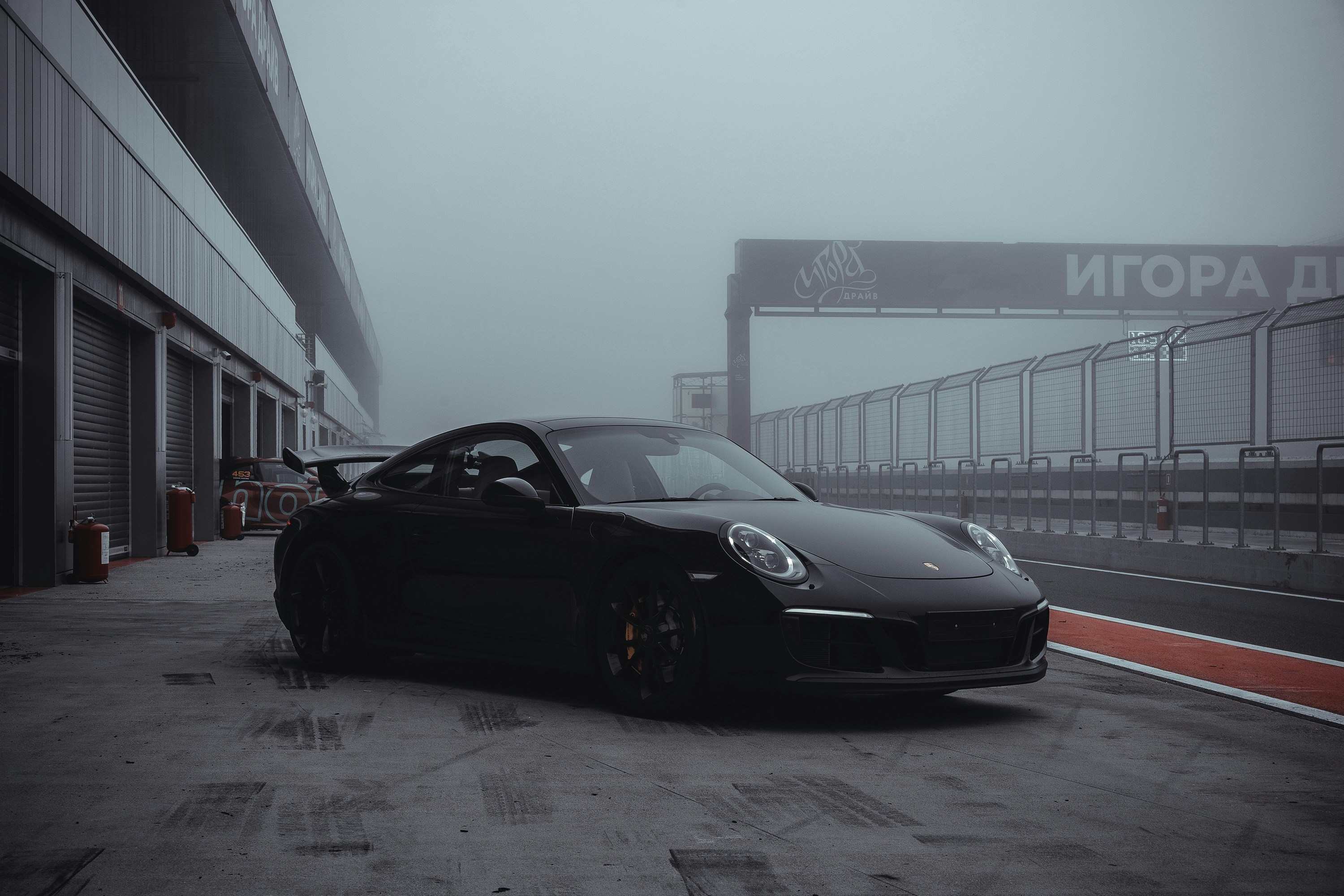 Fog-Kissed Porsche: a low-angle reveal in the pit lane
