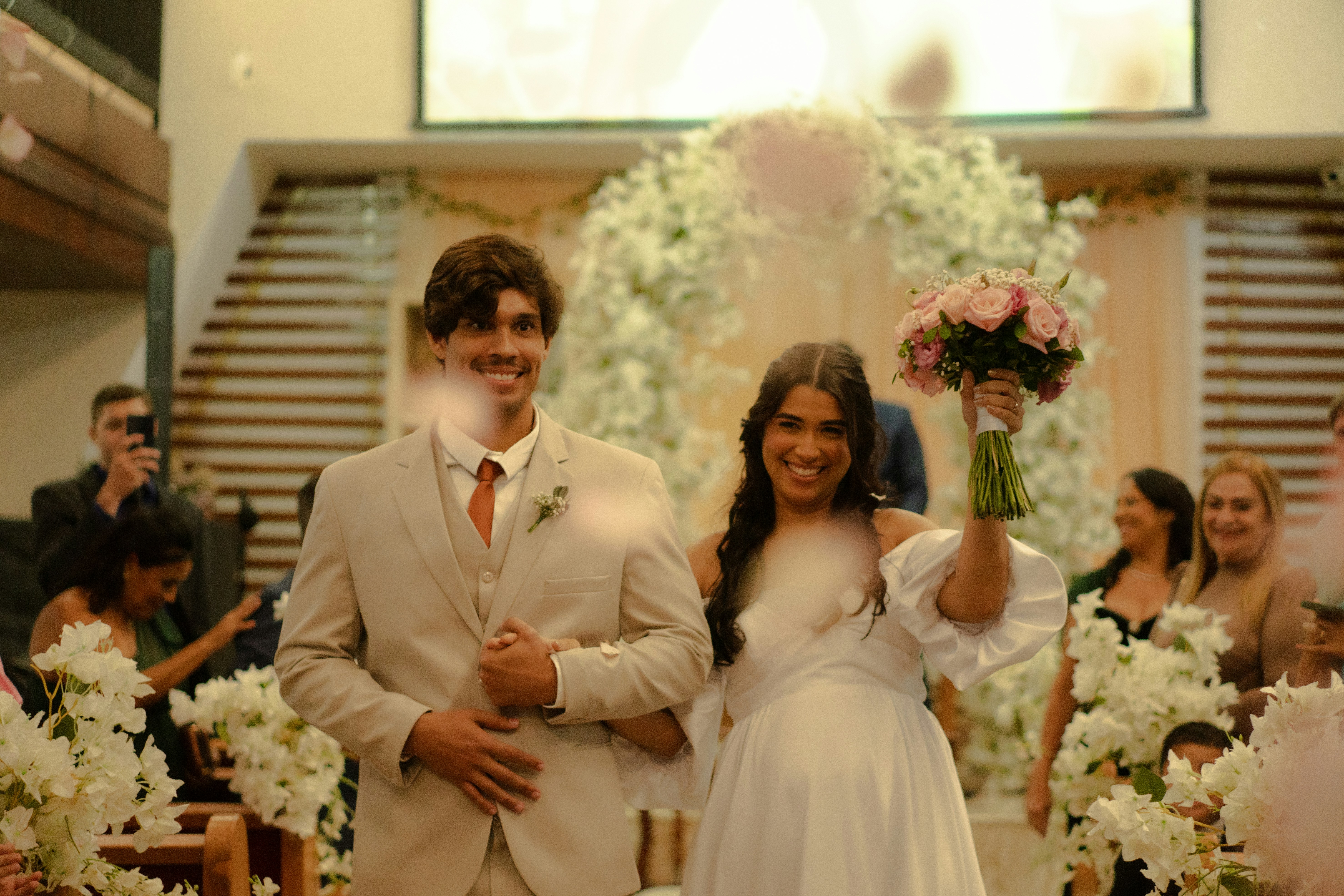 Aisle Moment: Bride Lifts Bouquet as Groom Walks Forward