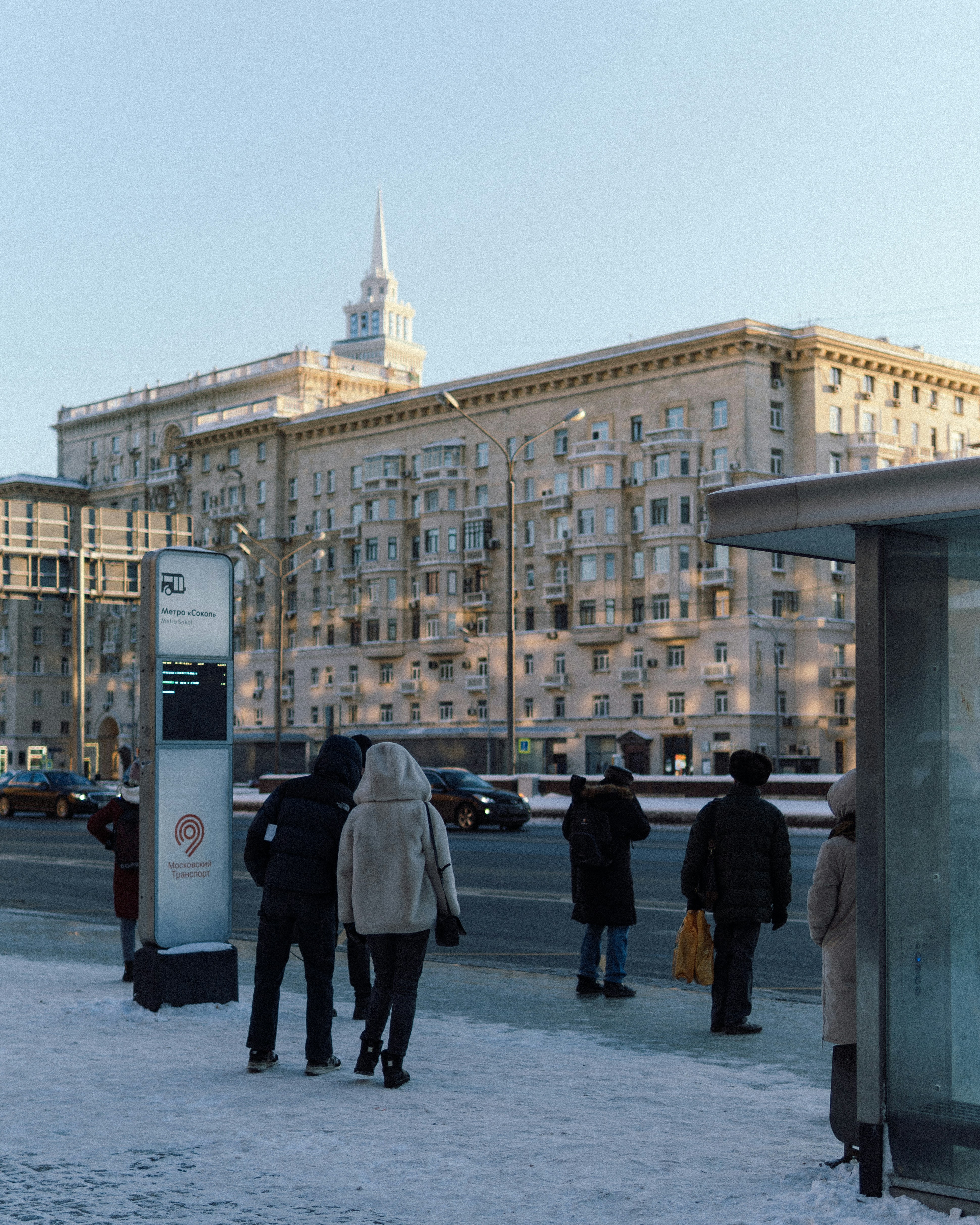 Frosty Crossing: Pedestrians pause at the urban edge
