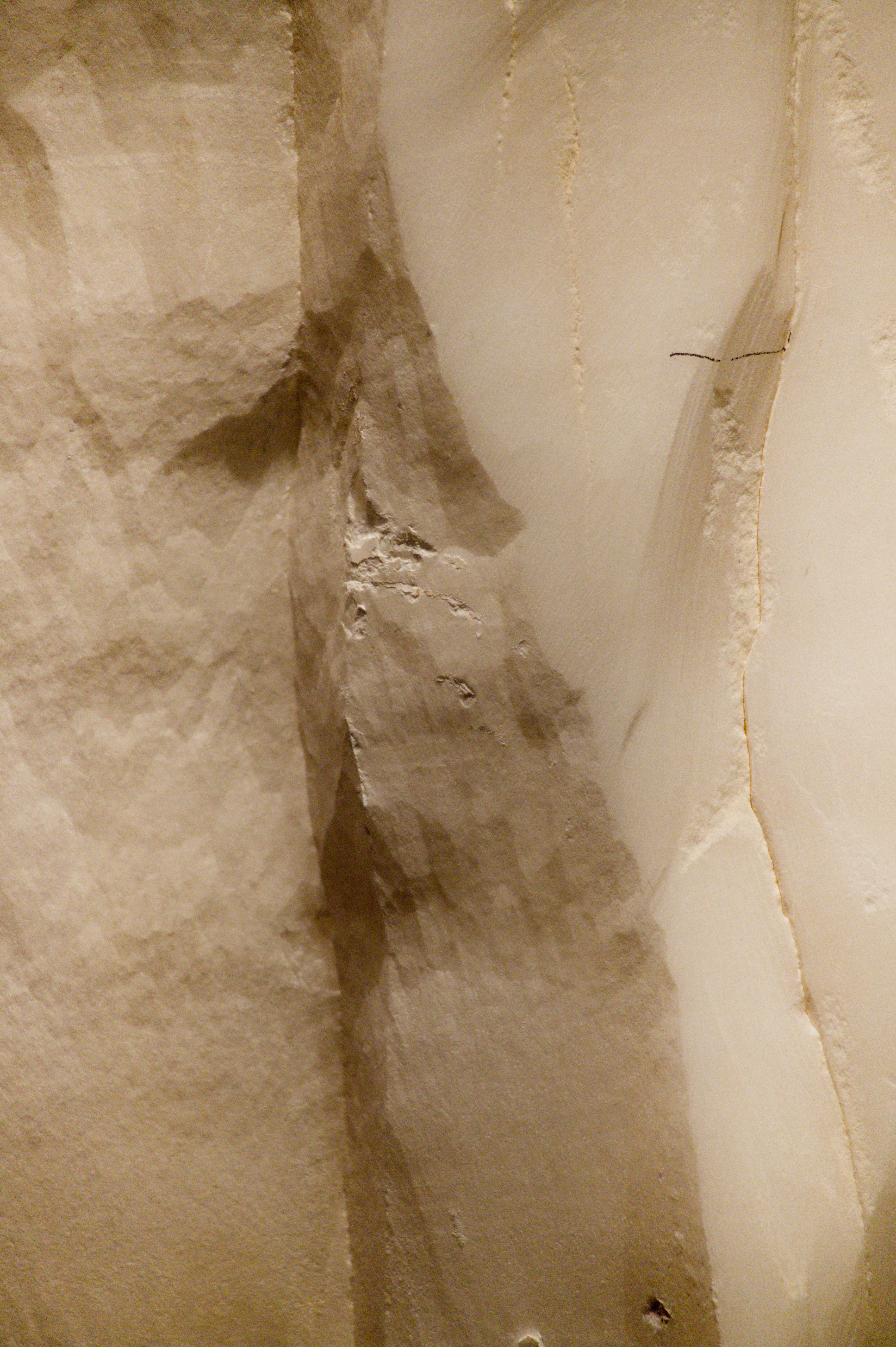 Amber Seams: A Close-Up of a Pale Rock Face