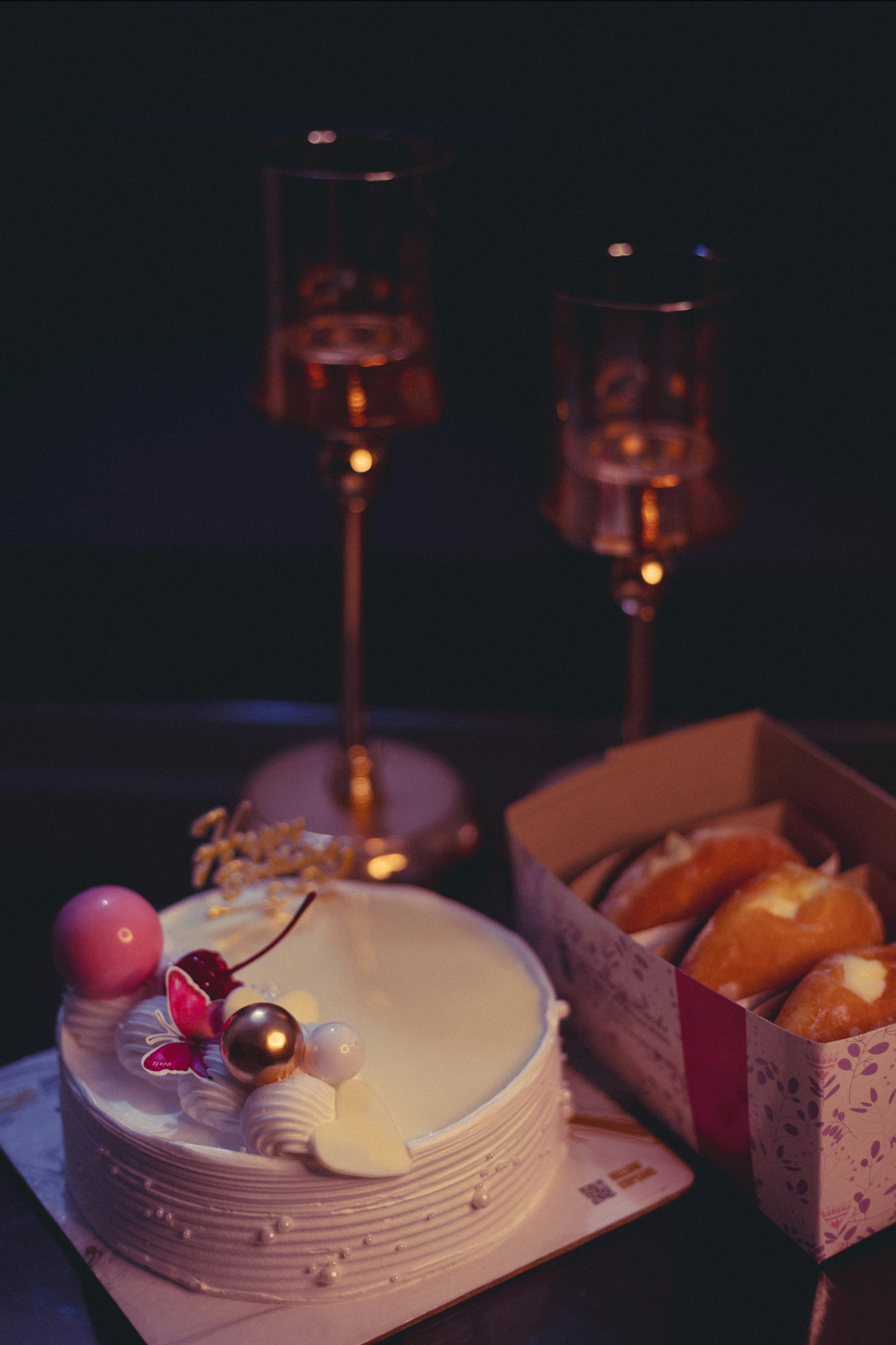 Candlelit Centerpiece: Cake in Warm Glow with Pastry Box