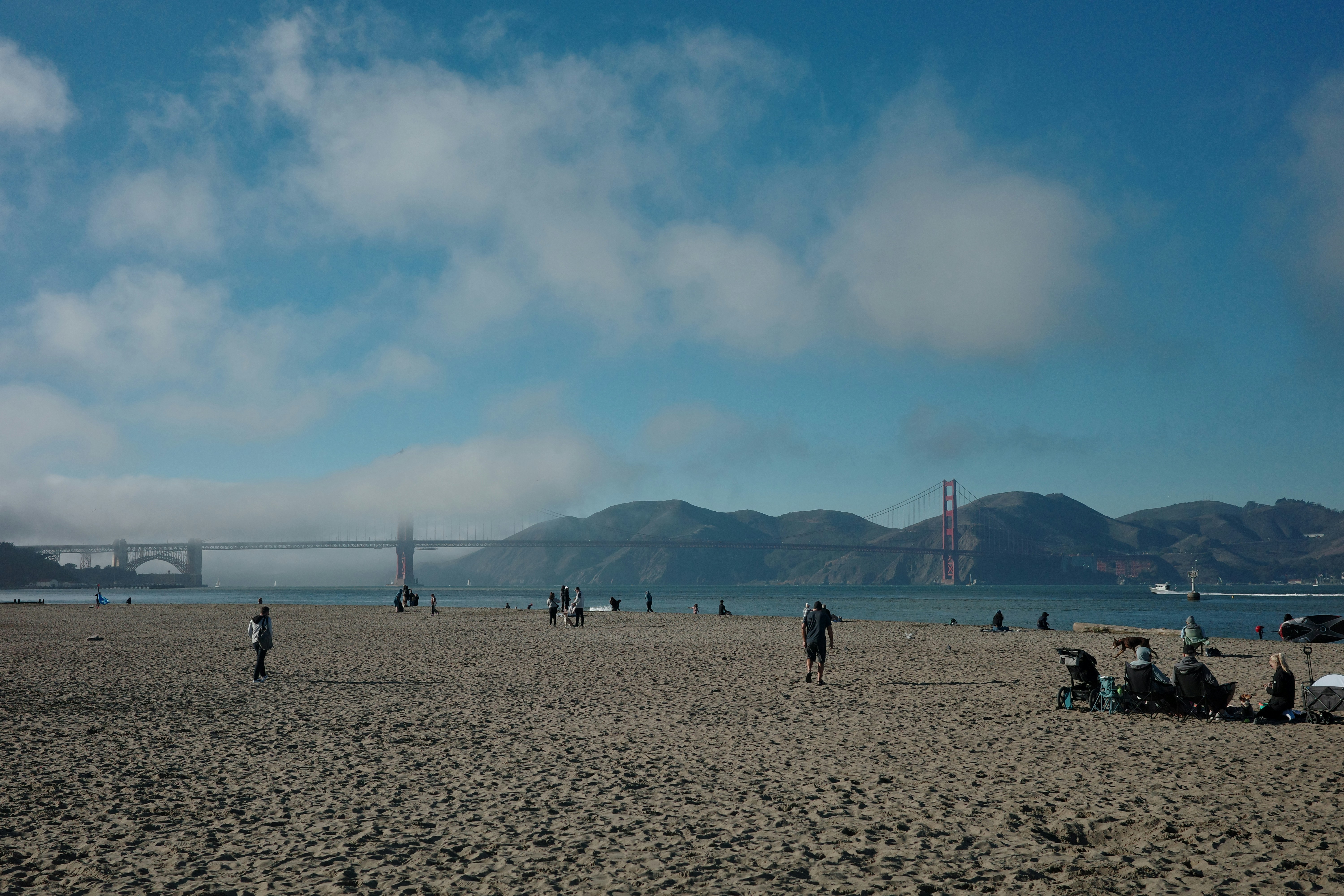 Dunes, Sea, and the Red Span: A Quiet Bay Morning