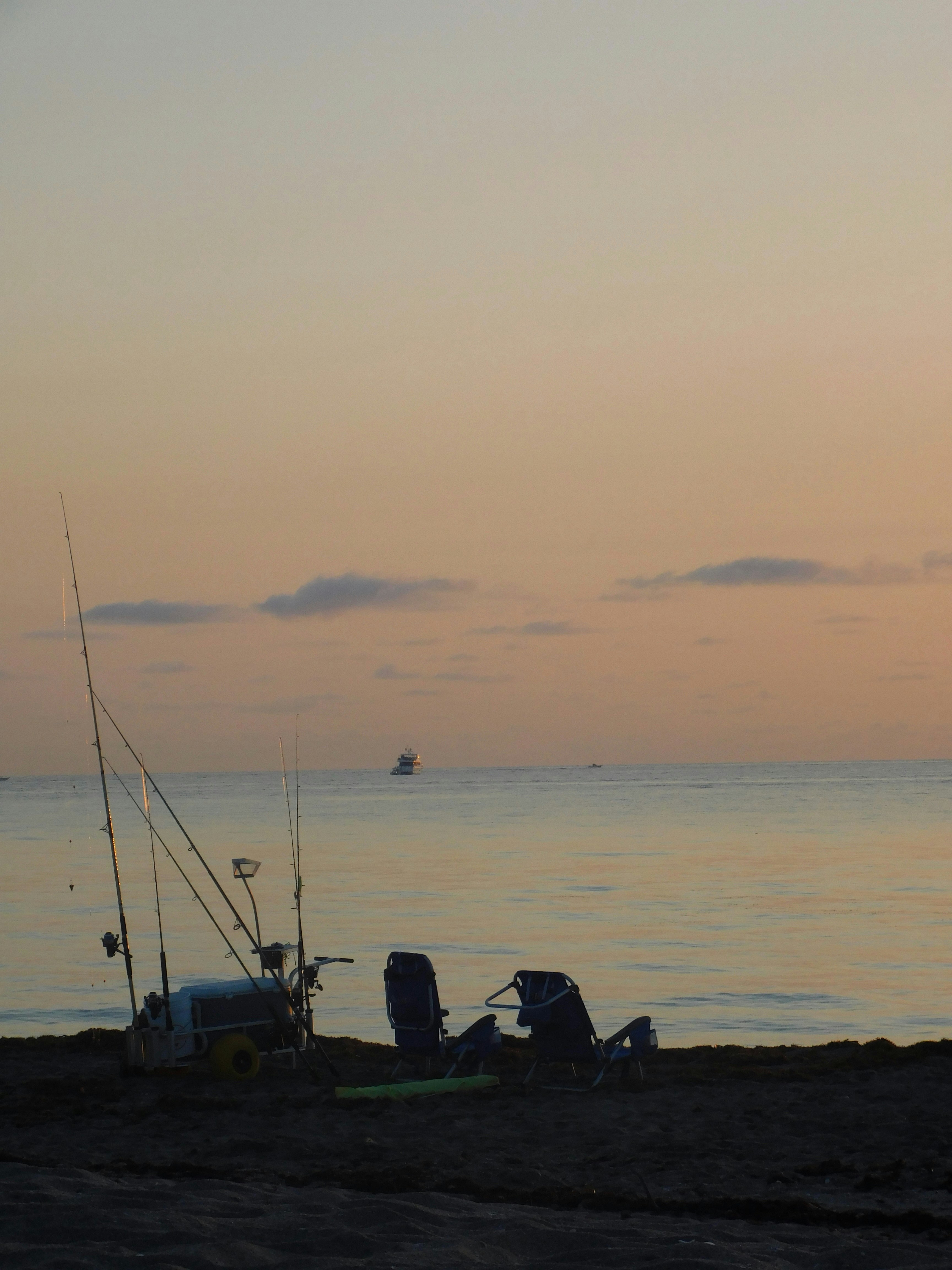 Dusk at the Tidal Edge: Fishing Gear Resting by the Sea