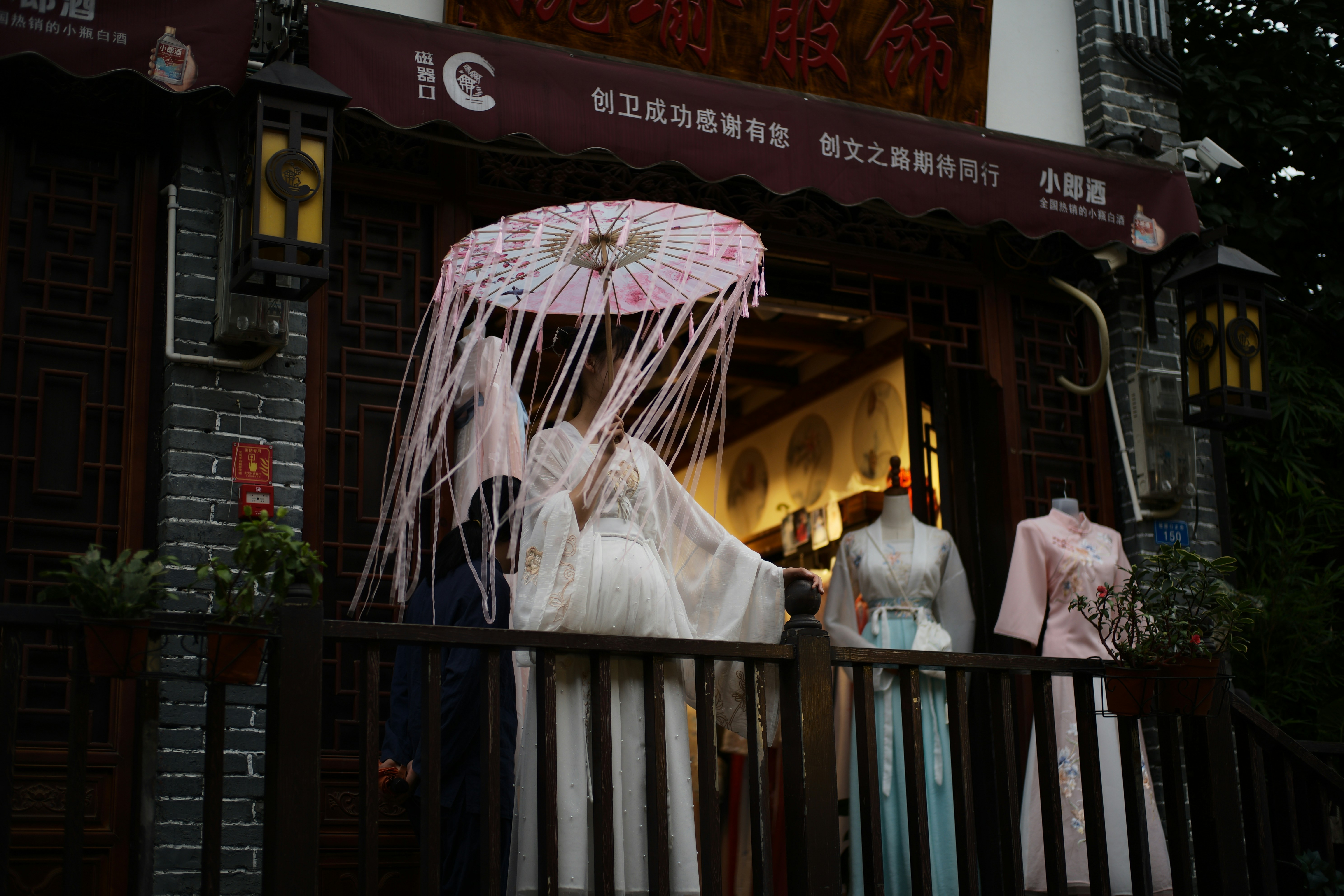 Veil Under a Pink Umbrella: Bridal Window on a Balustrade