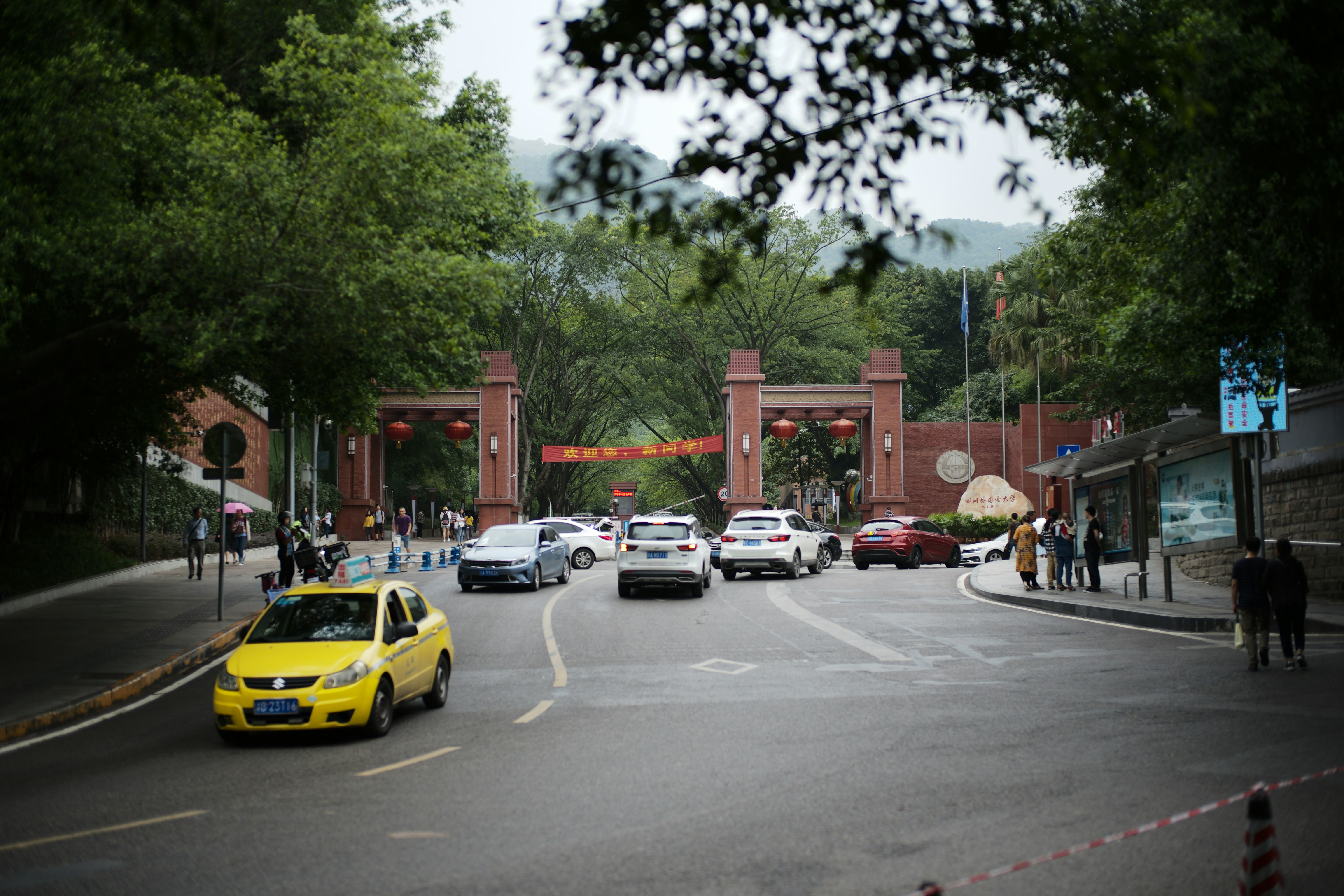 Red Arch Gate at the End of a Busy Street