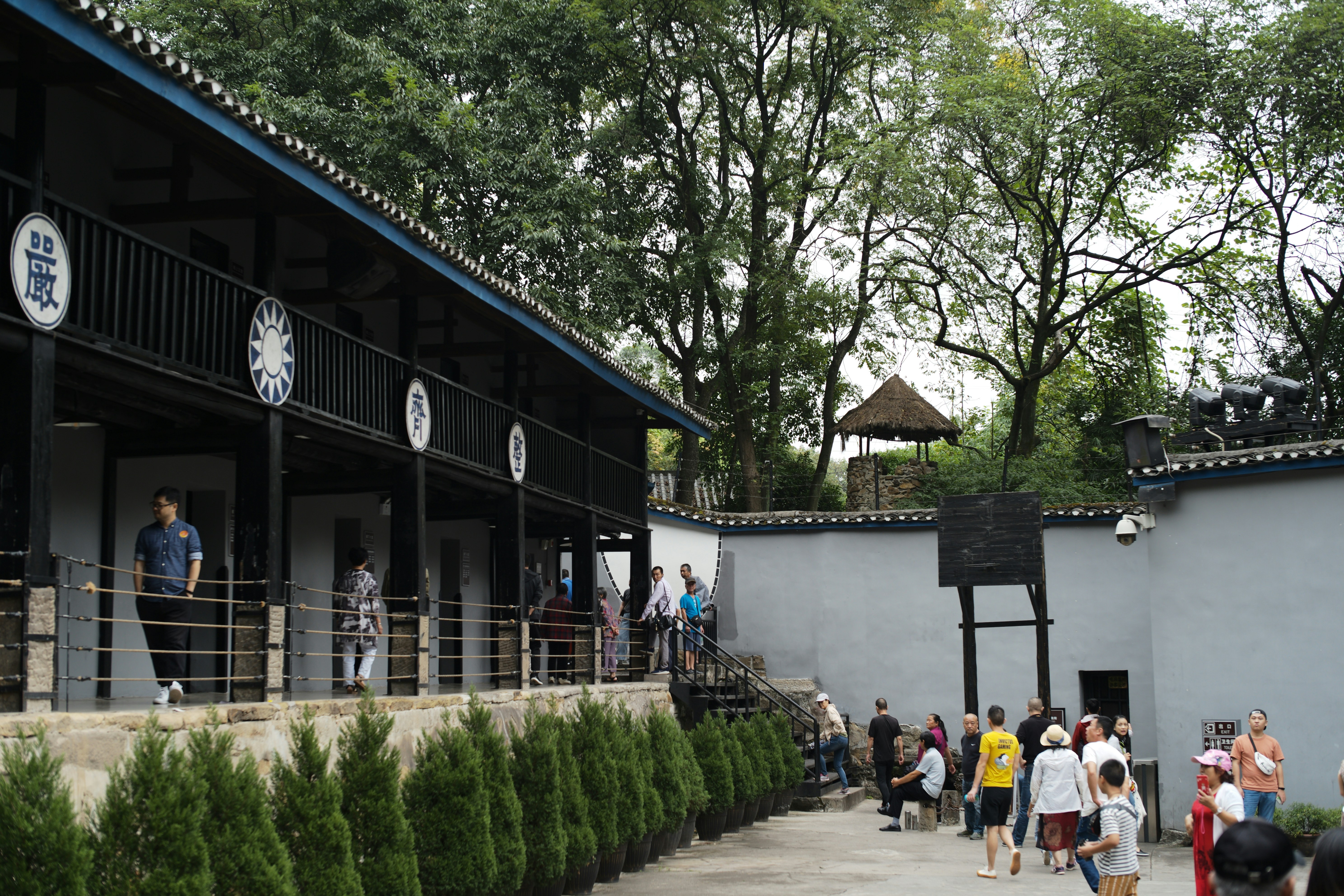 Courtyard Confluence: Visitors Stream Through a Traditional Pavilion