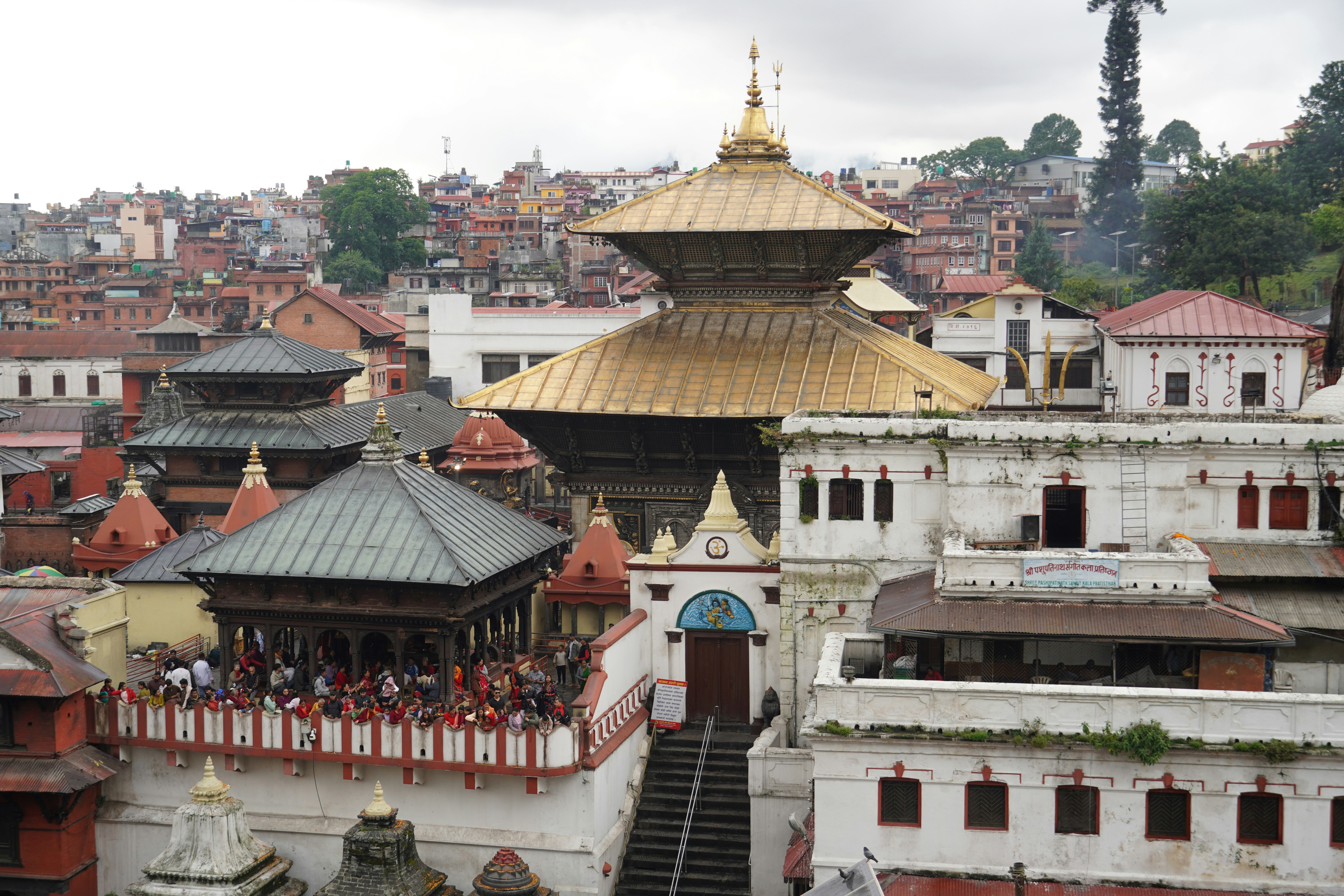 Gilded Peak Over Kathmandu's Red-Walled Labyrinth