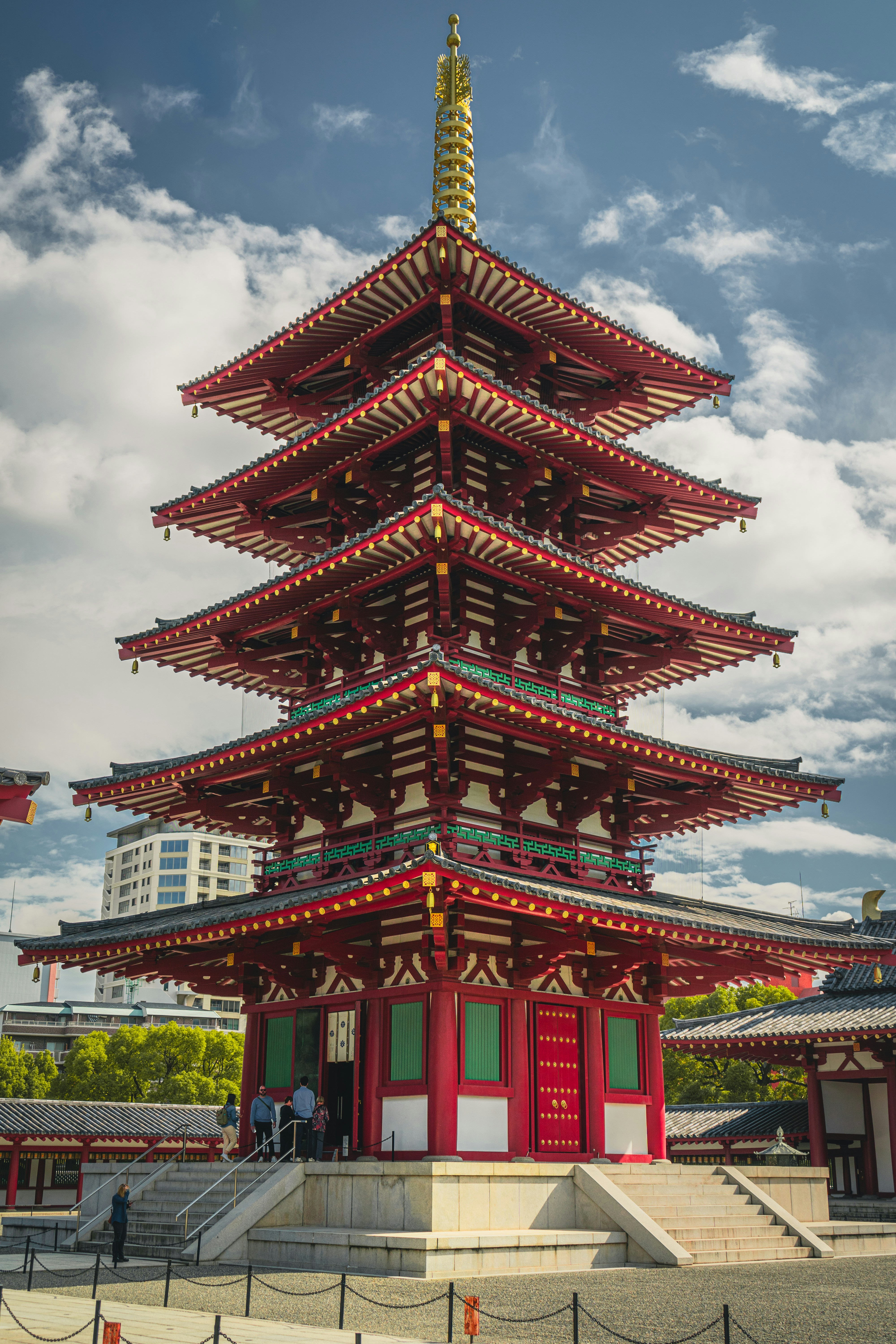 Crimson Spires: A Five-Tier Pagoda Reaching Toward a Clear Sky