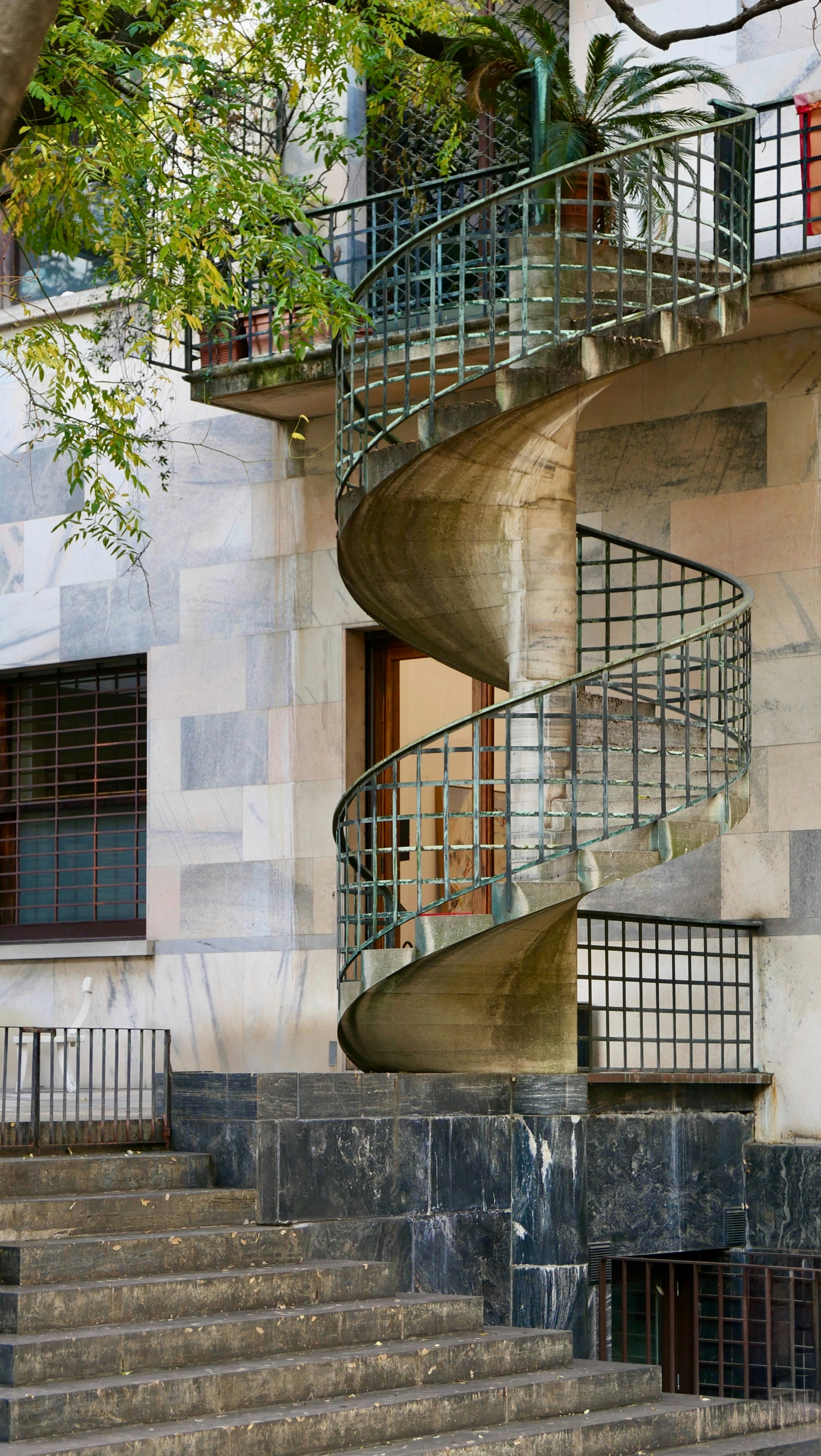 Spiral Beat: A Marble Facade Embraces an Urban Staircase