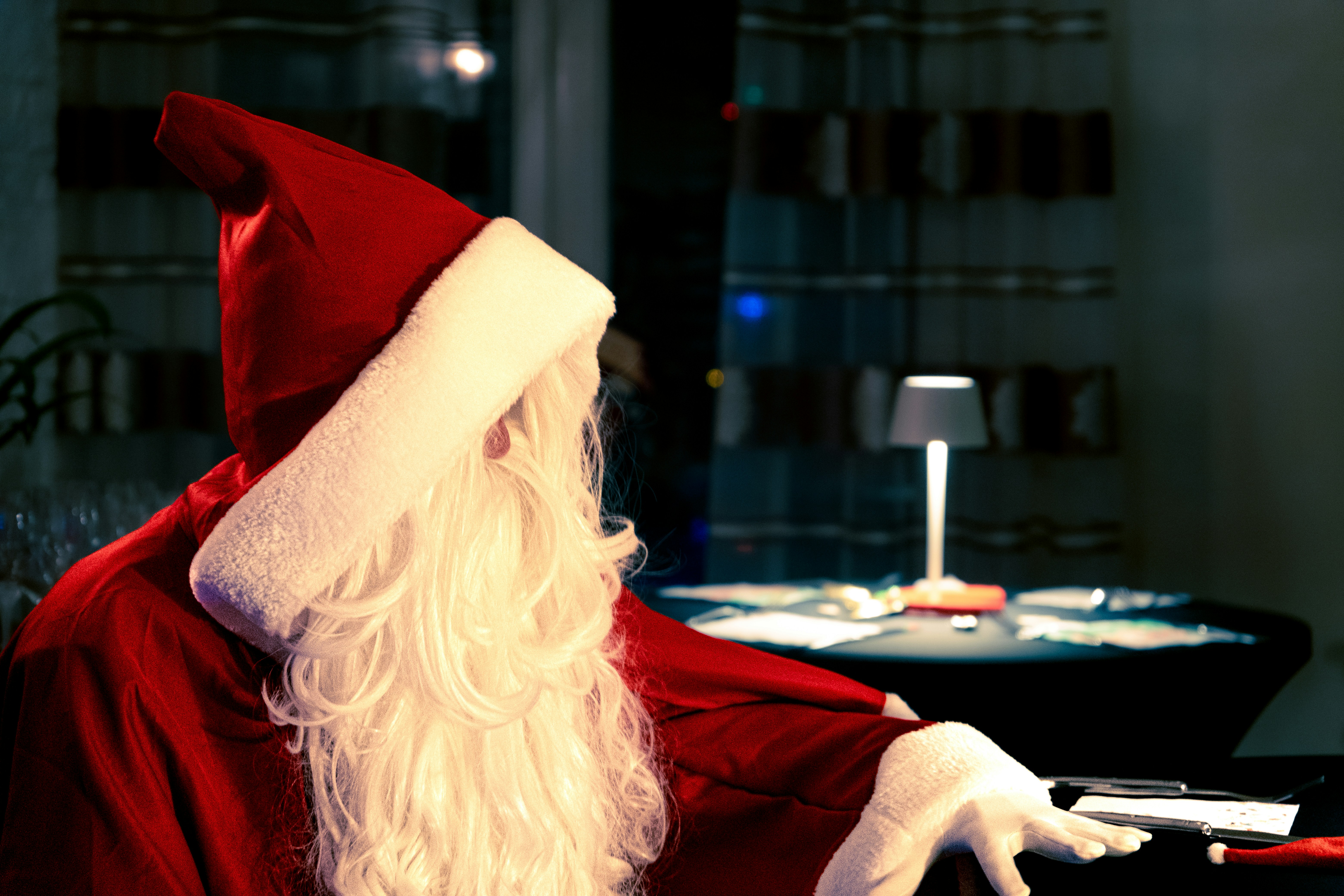 Desk-Lamp Santa: A Quiet Moment in Red Velvet