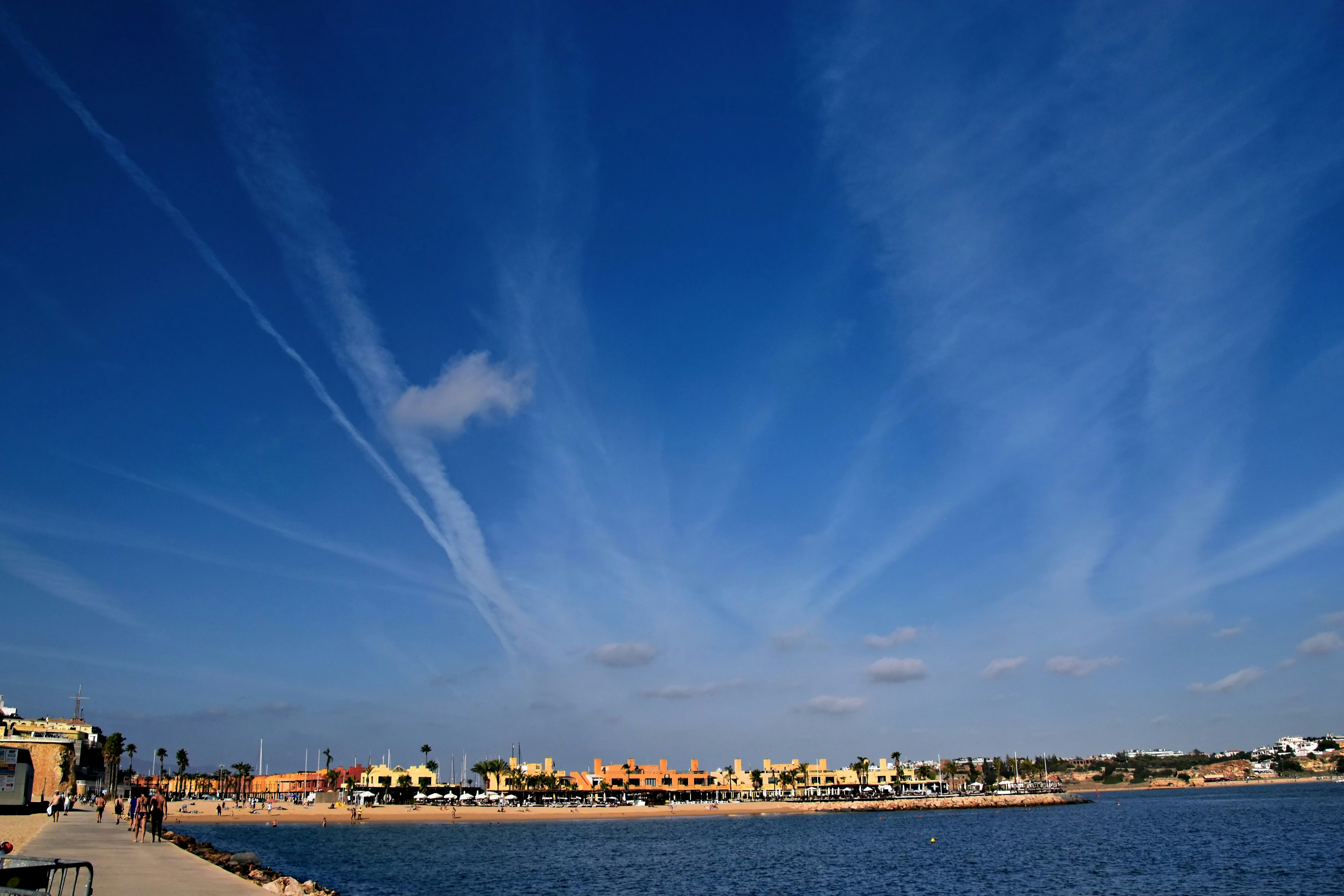 Colorful Waterfront Row Beneath a Wide Blue Sky