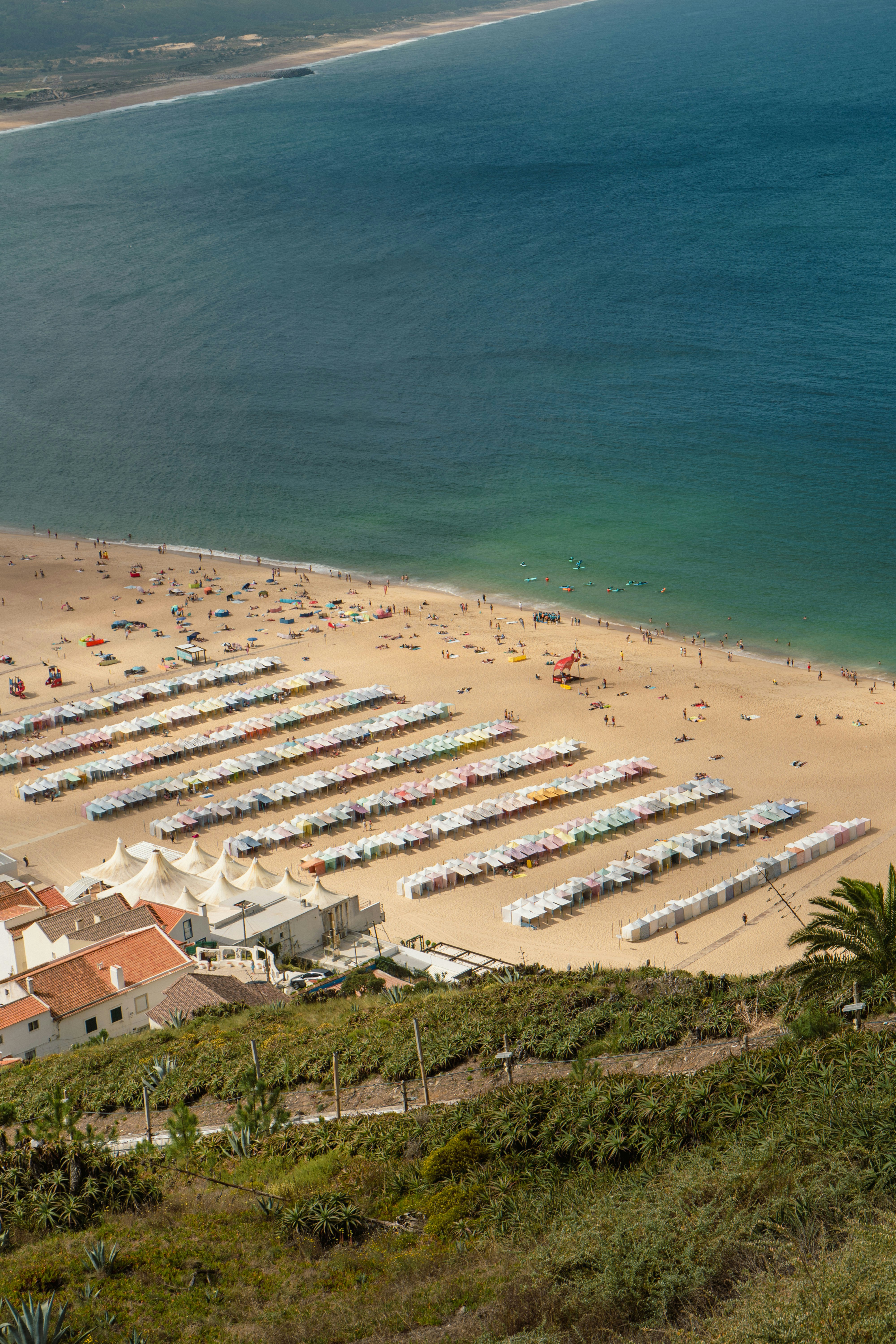 Terraced Sun Loungers Line a Turquoise Beach