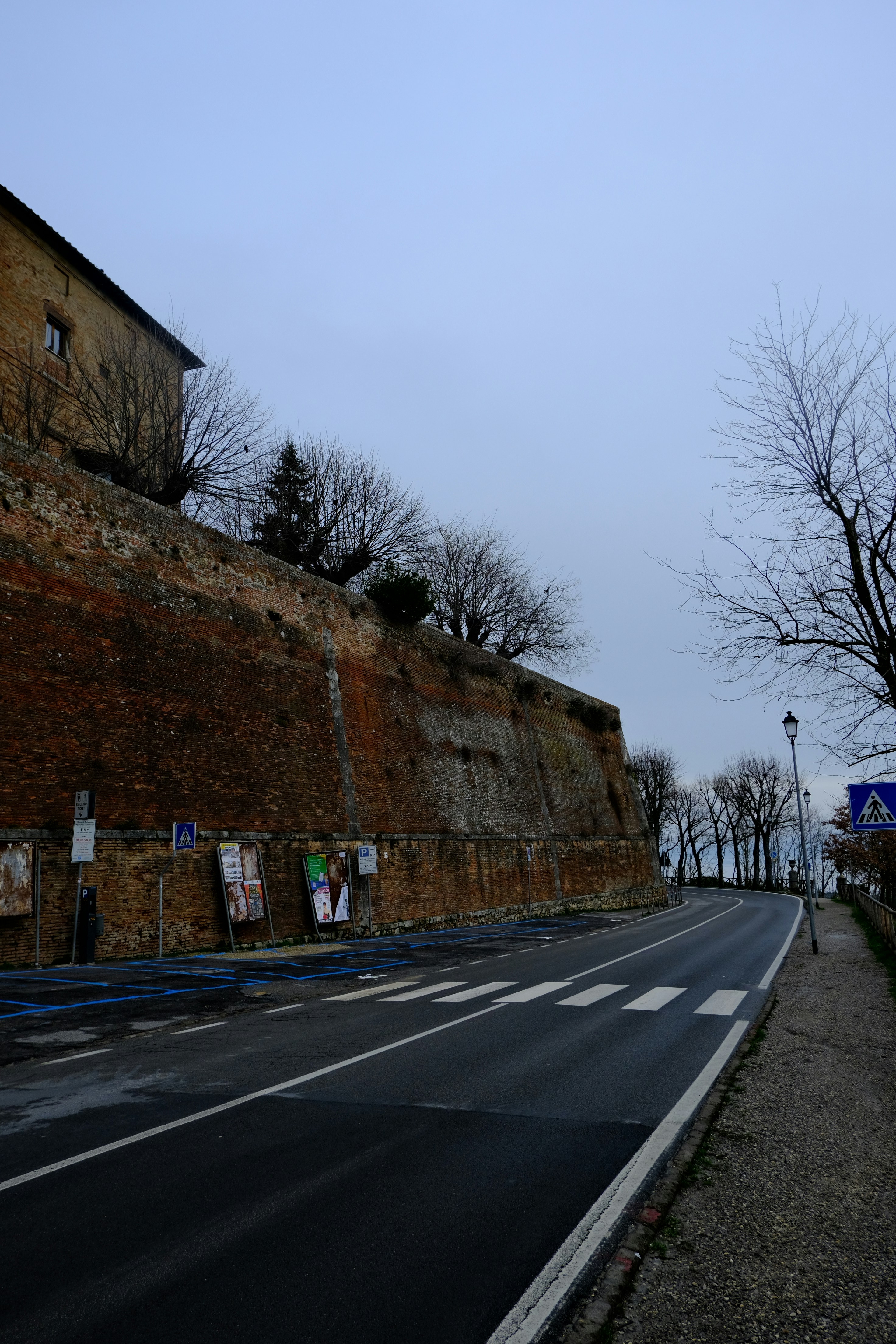 Rampart Road: Weathered Brick Facade Along a Quiet Hillside