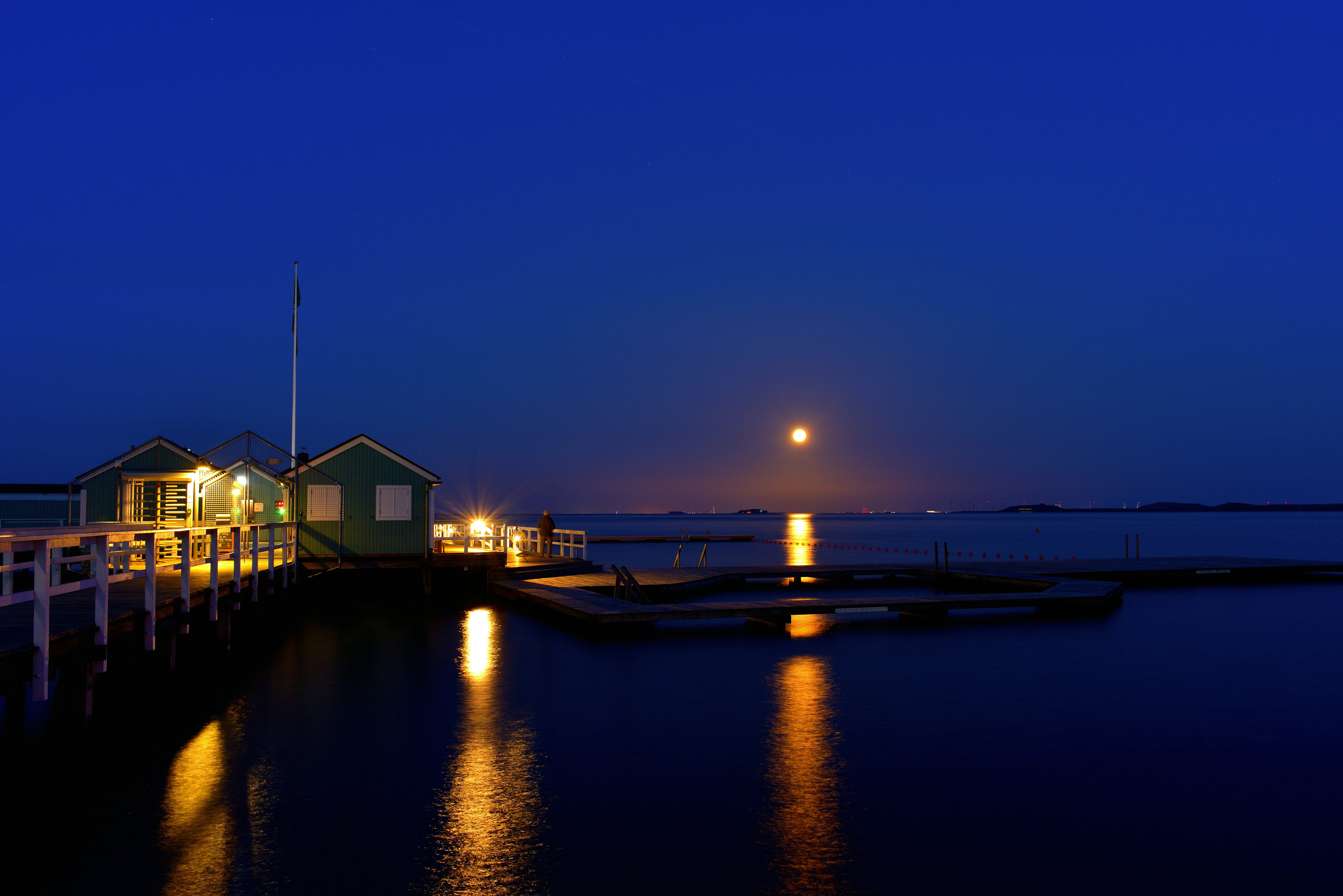 Moonrise Over the Quiet Harbor Pier