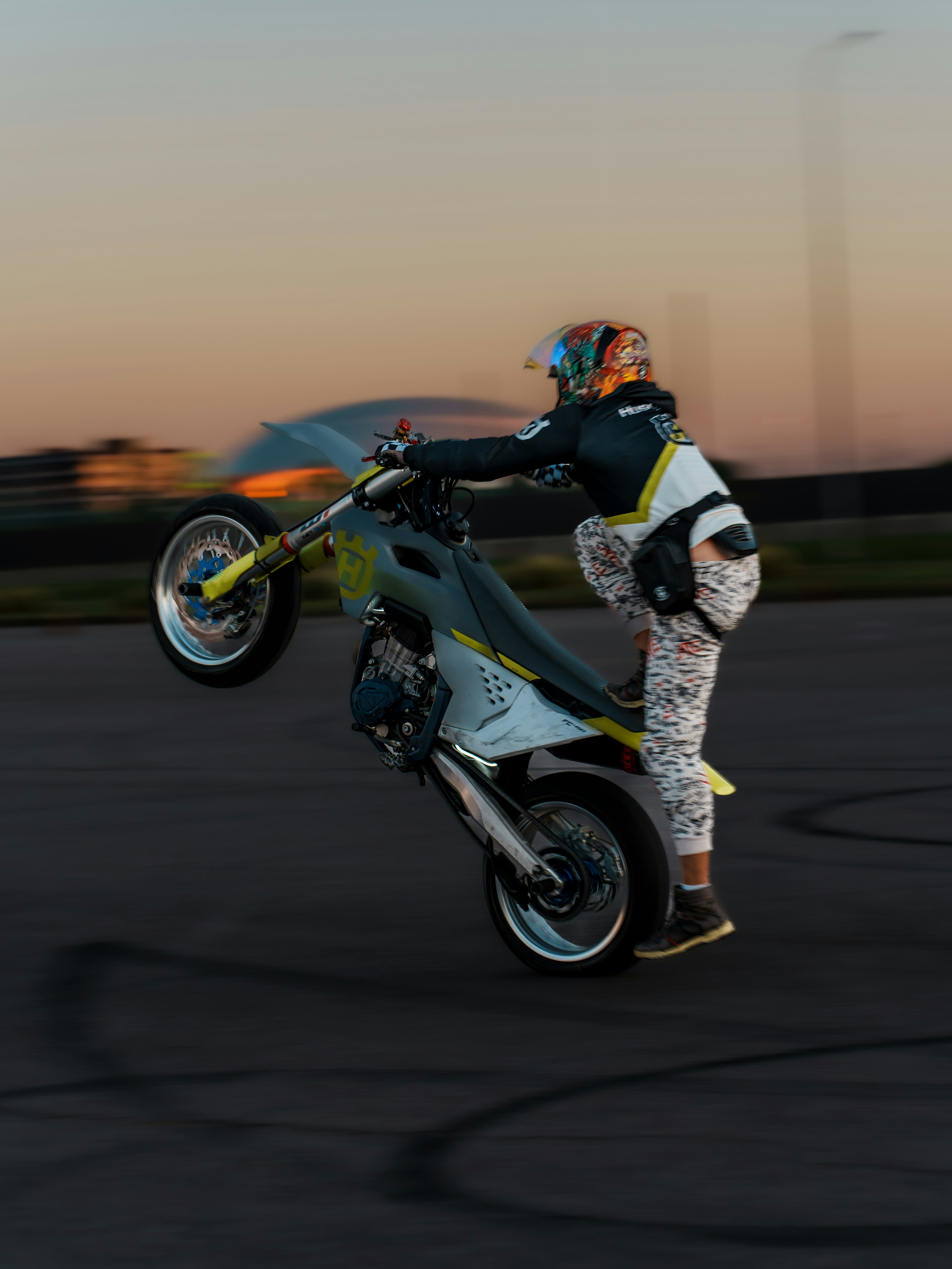 Dusk Wheelie: Balance and Blur on a Quiet Road