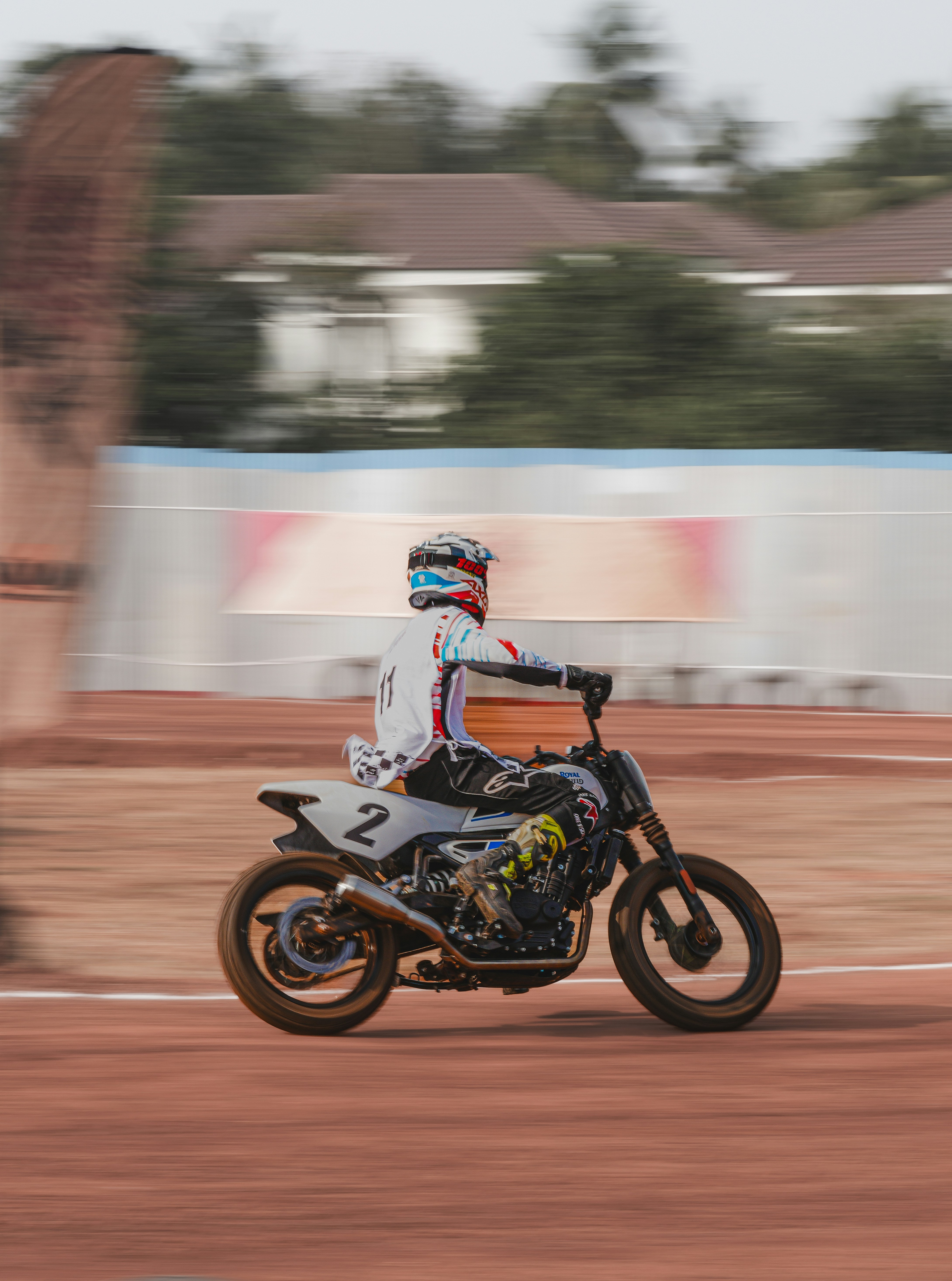 Dust Trail Sprint: Dirt-Bike Rider in Red Clay Motion