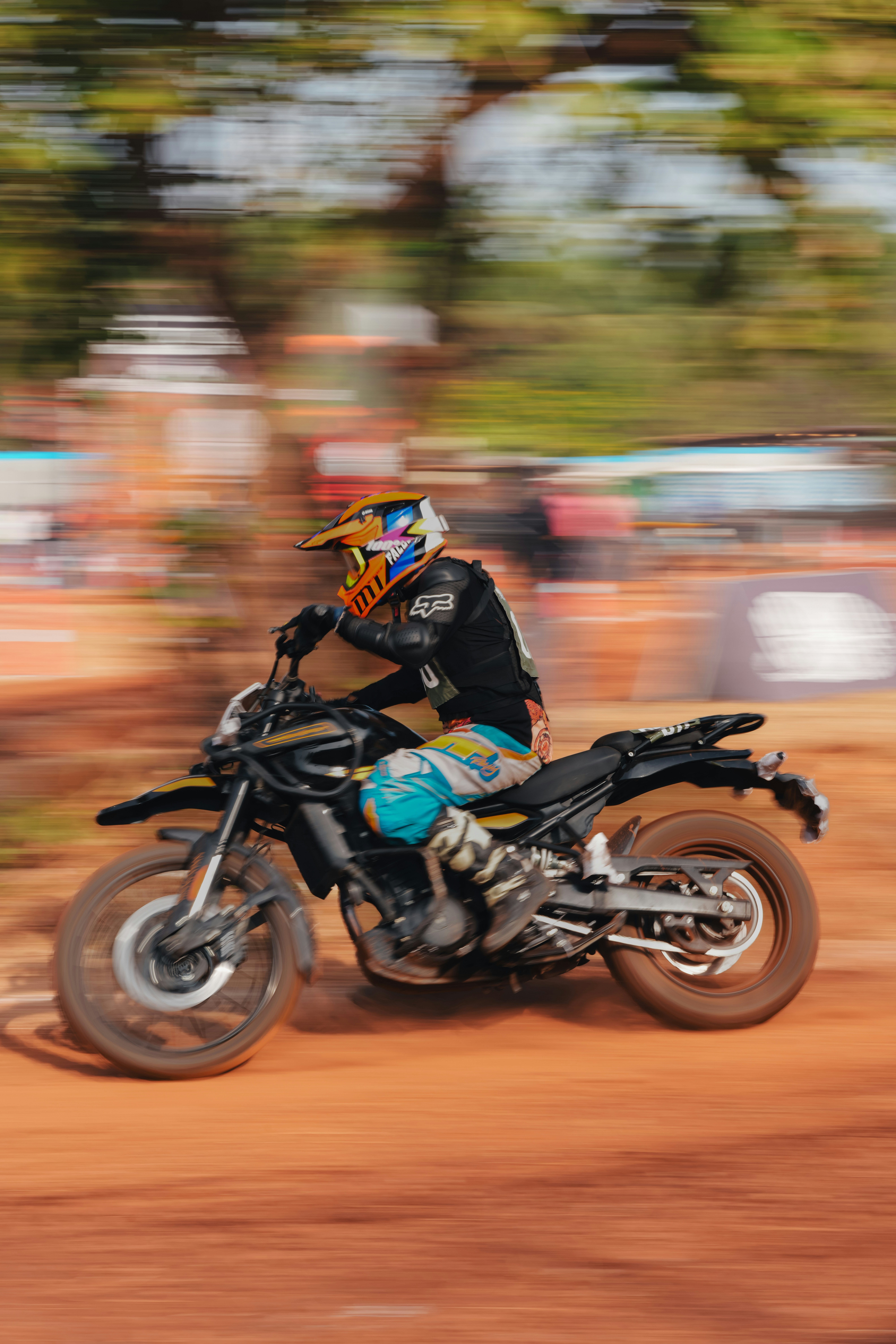 Red Dust Sprint: A Motocross Rider Cutting Through the Blur