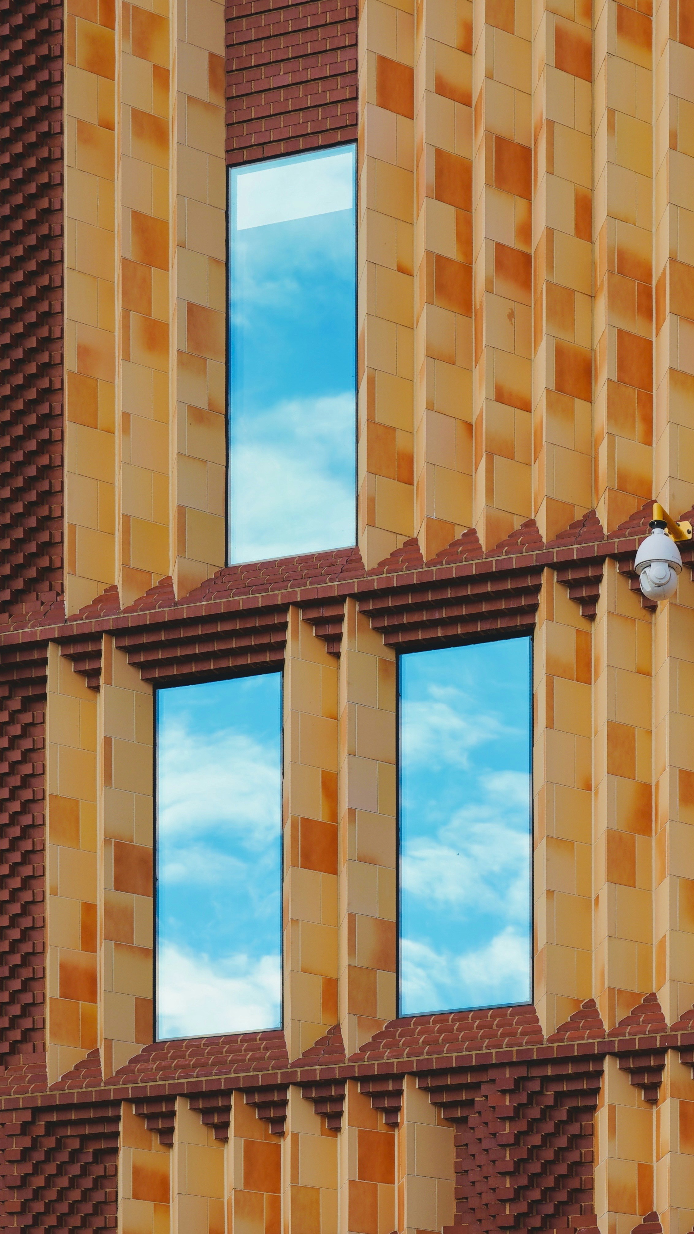 Azure Windows Framed by a Geometric Facade
