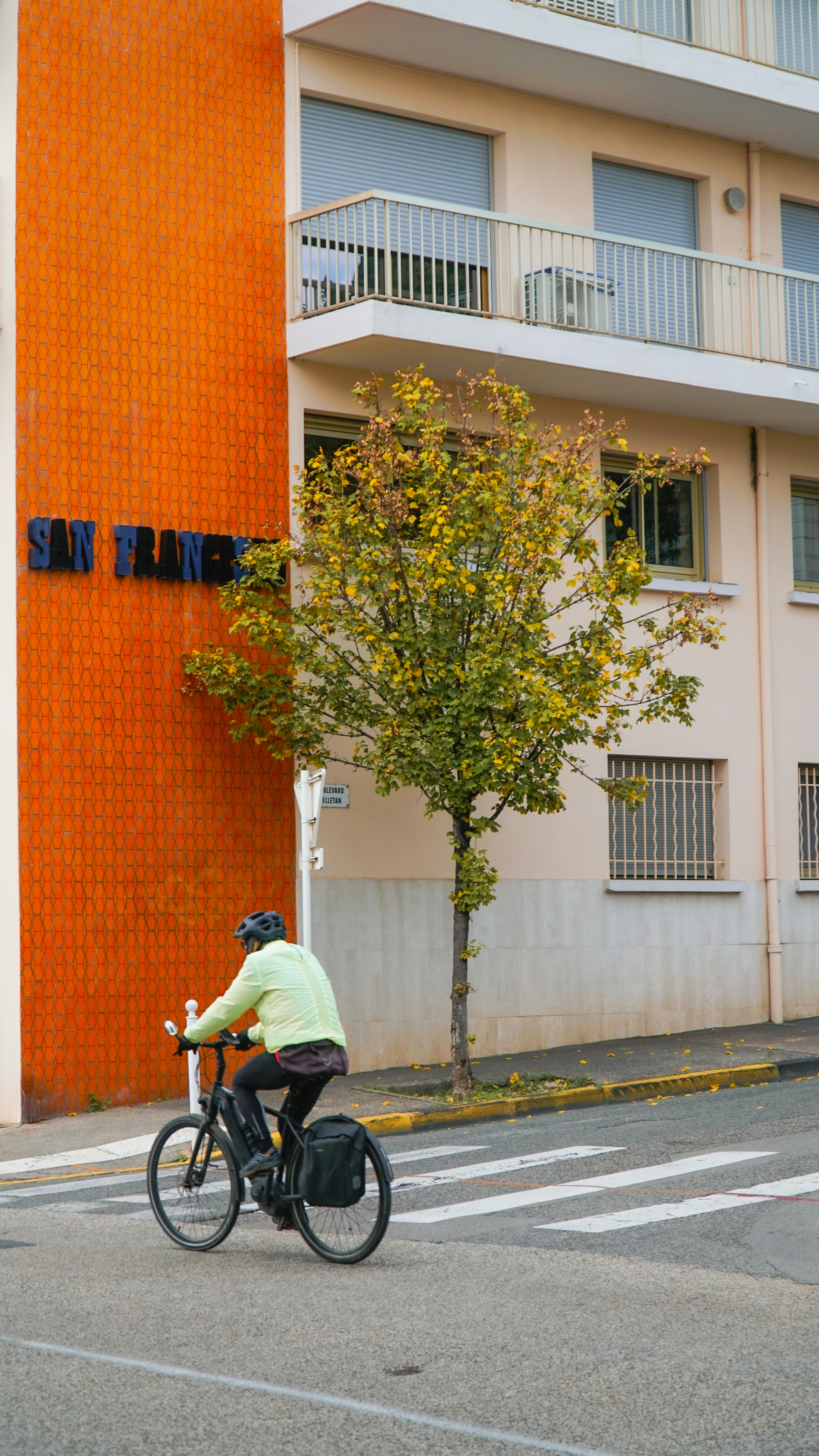 Lime Jacket, Tangerine Wall: A Quiet City Ride