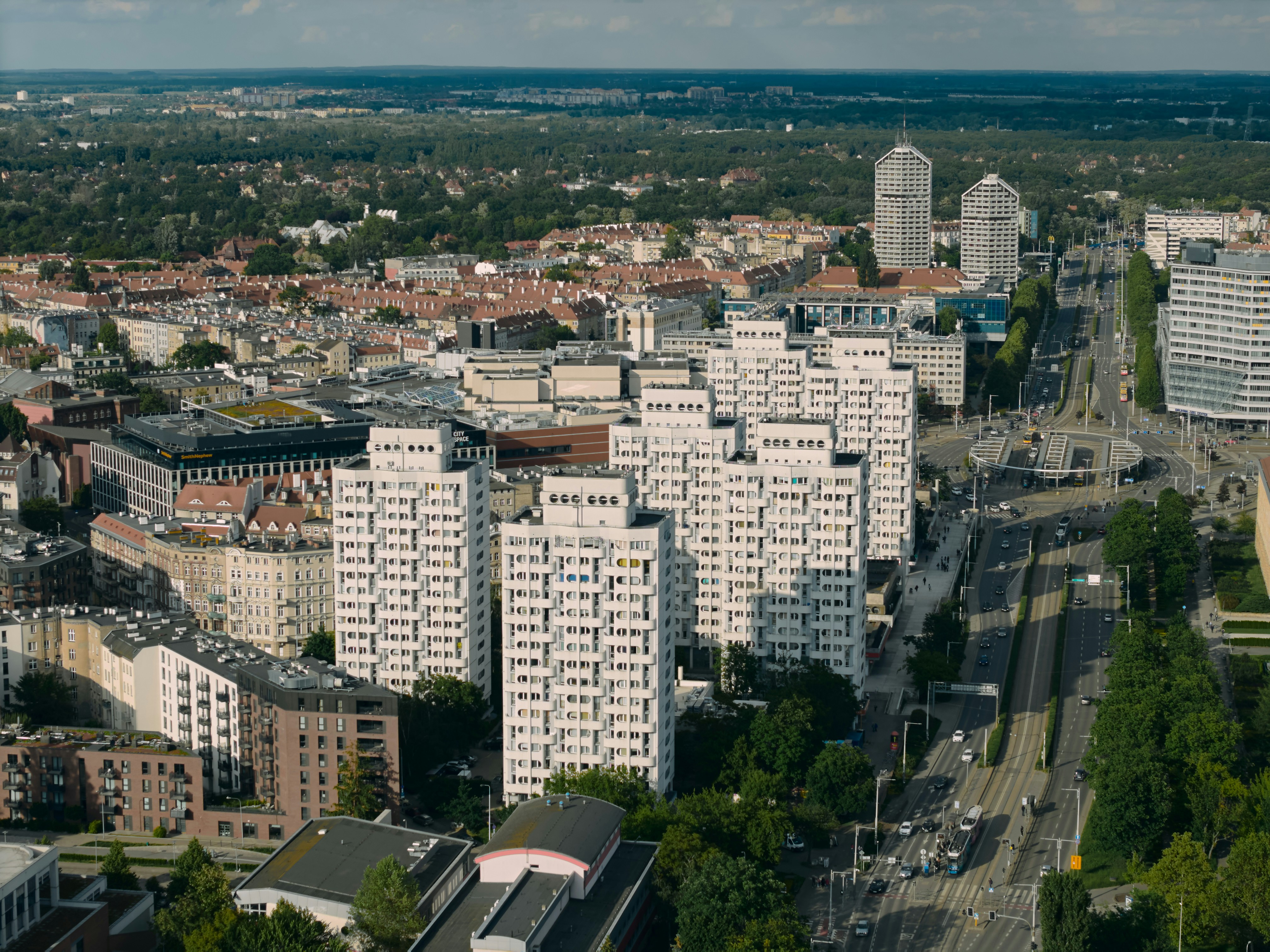 Modern apartment buildings in a dense urban cityscape.