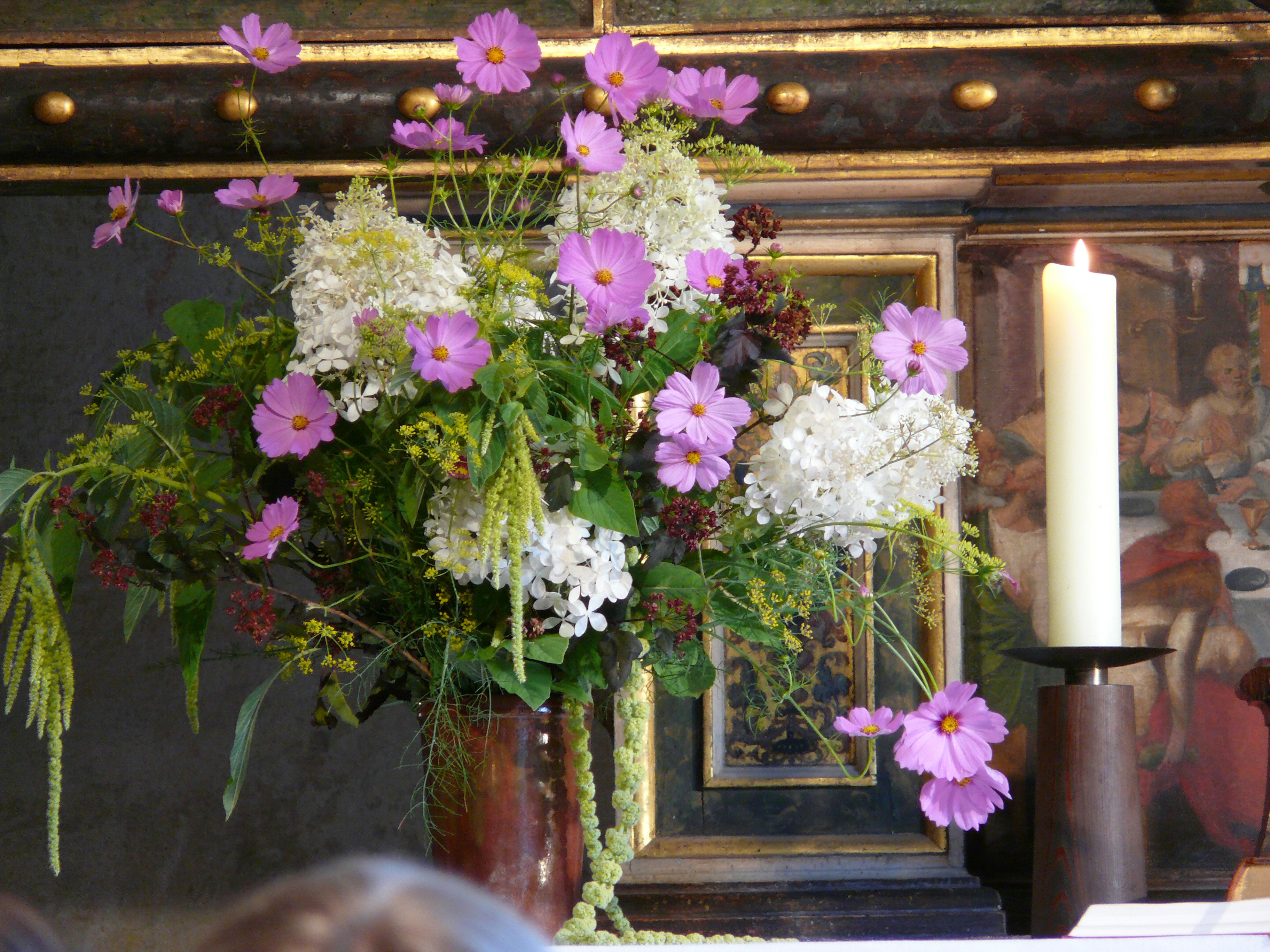 Floral Arrangement Beneath Candled Frame