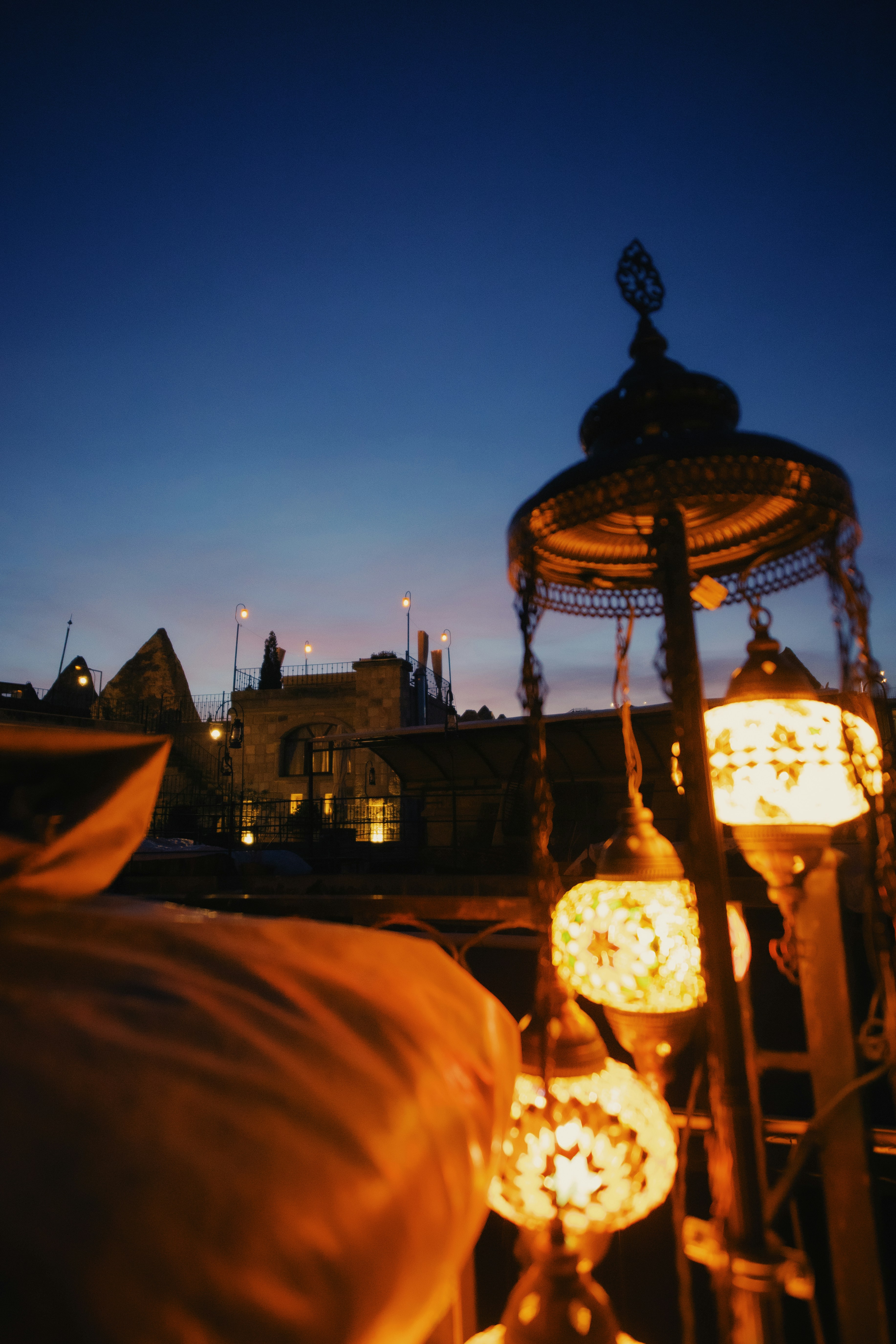 Amber Lanterns on a Rooftop at Dusk