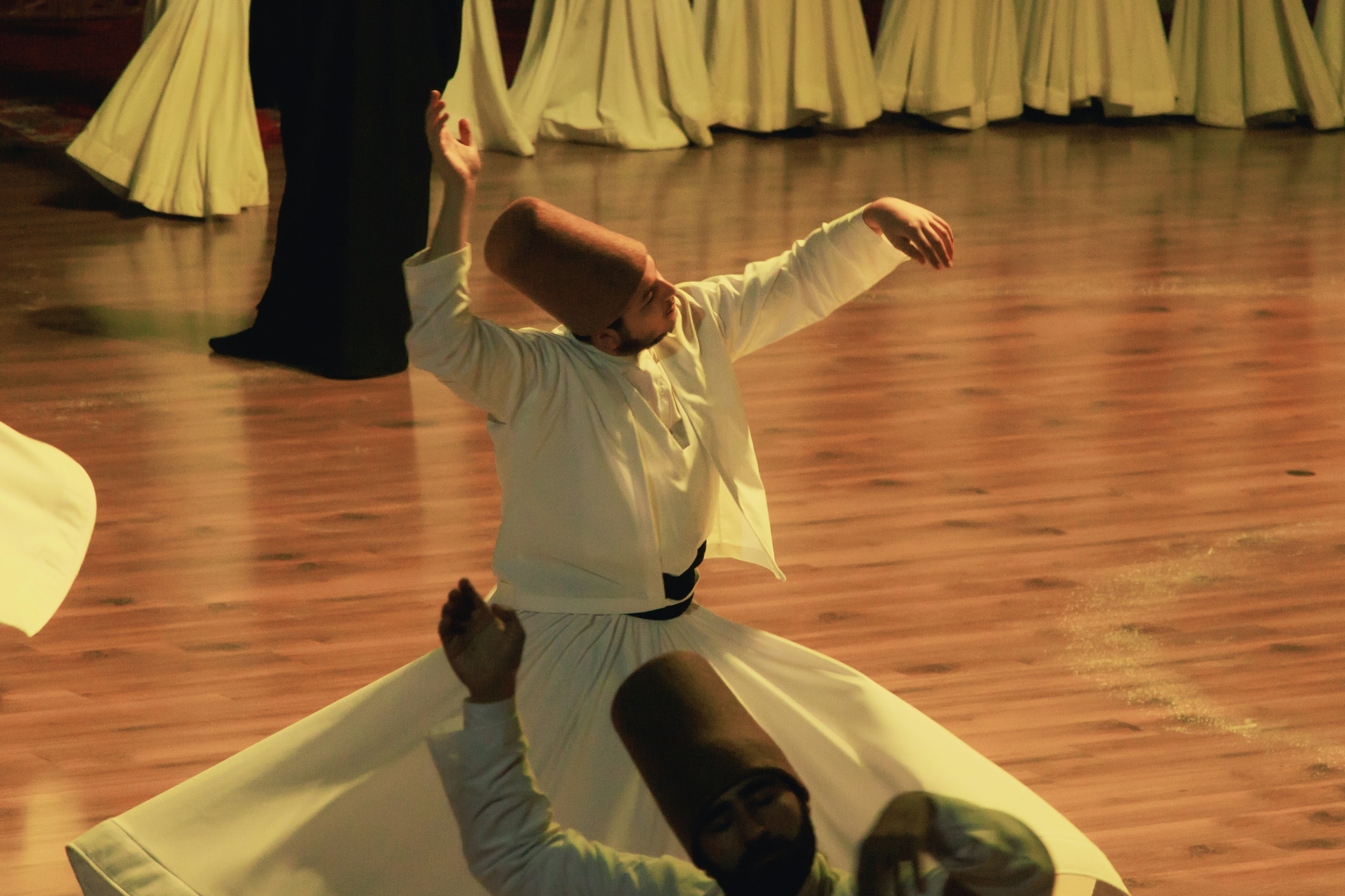 Arc of White: A Dancer’s Centered Spin on a Shimmering Stage