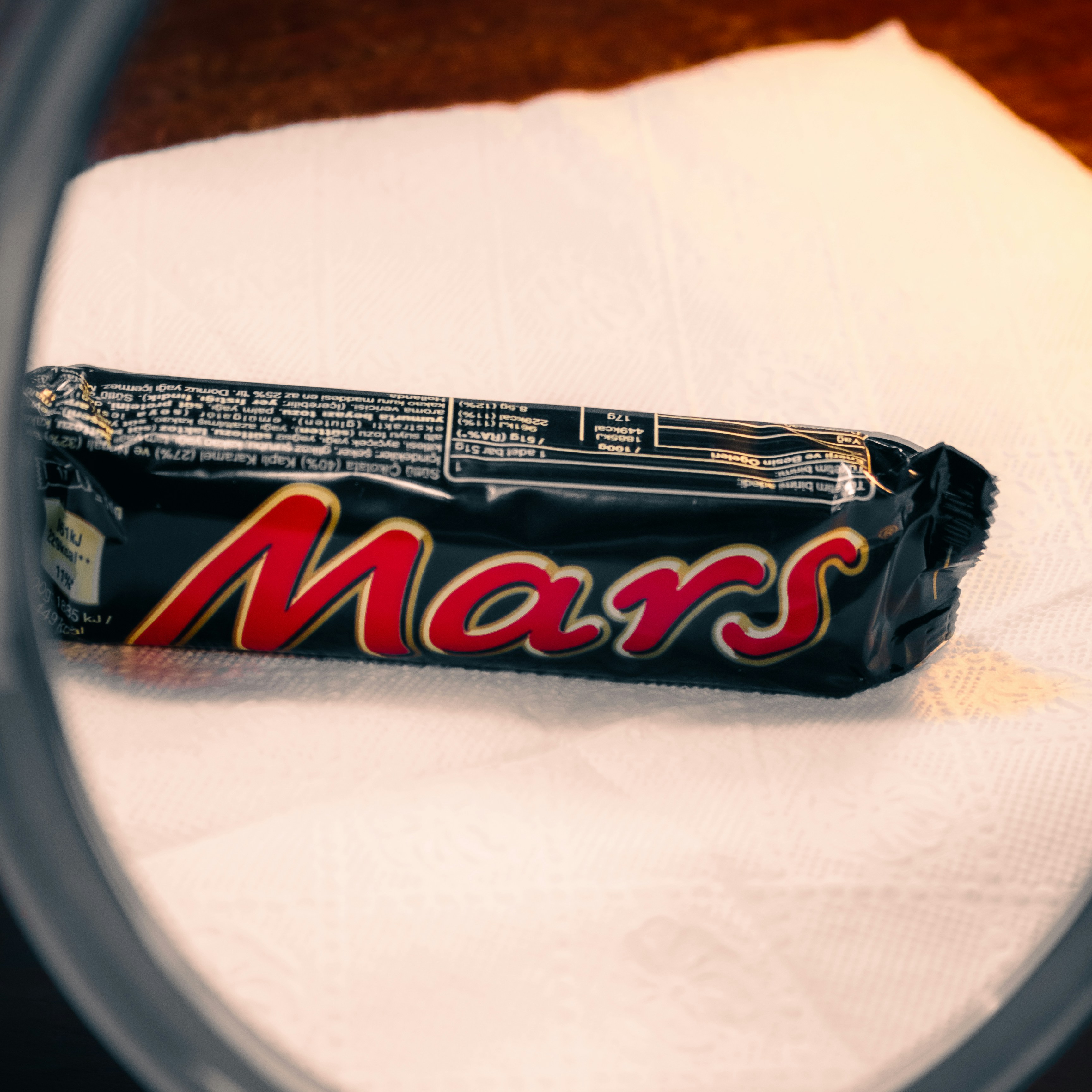 Mars on a Paper Stage: A Close-Up Snack Portrait