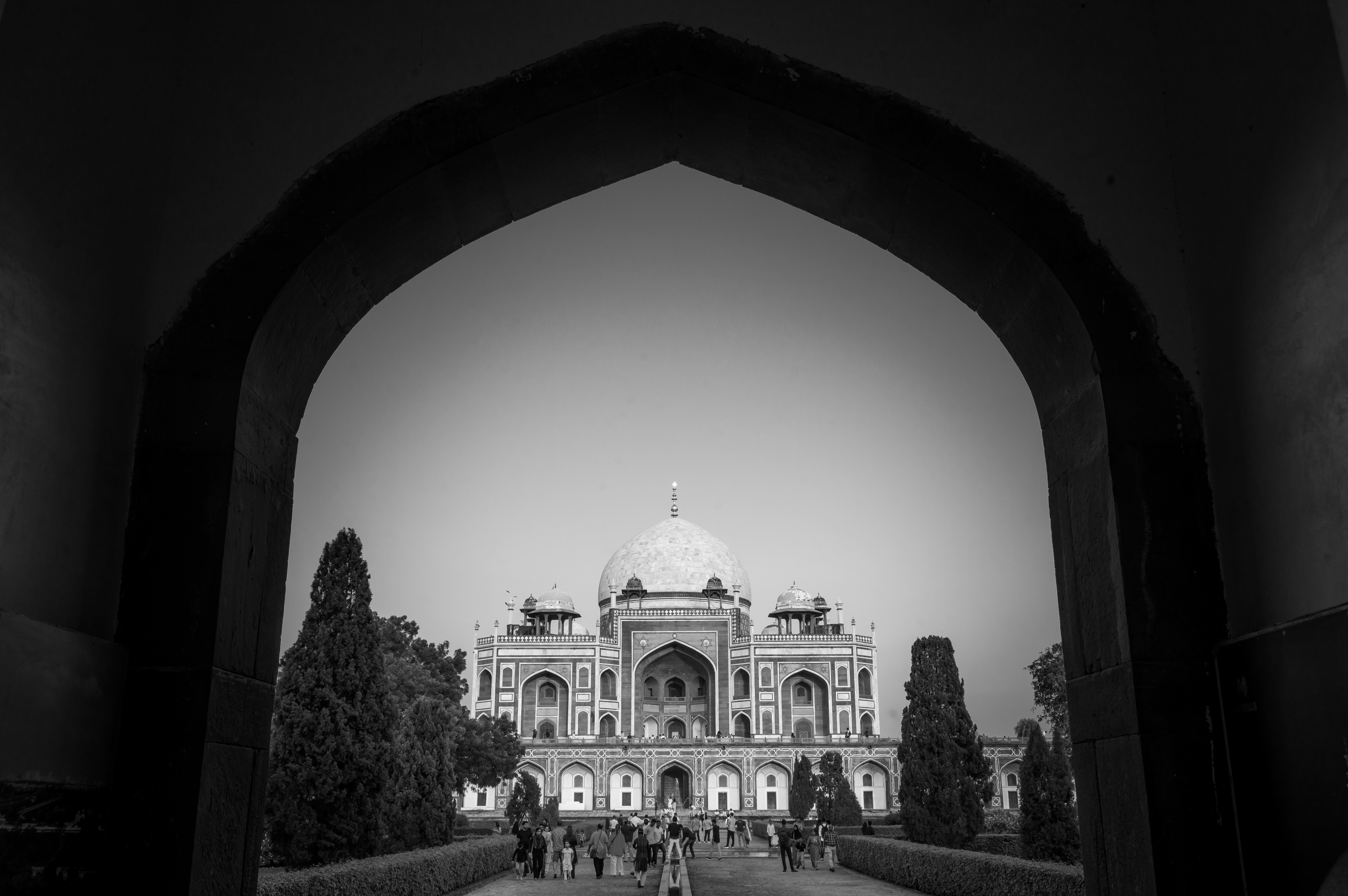 Archway Framing a Marble Pavilion: Symmetry in Monochrome