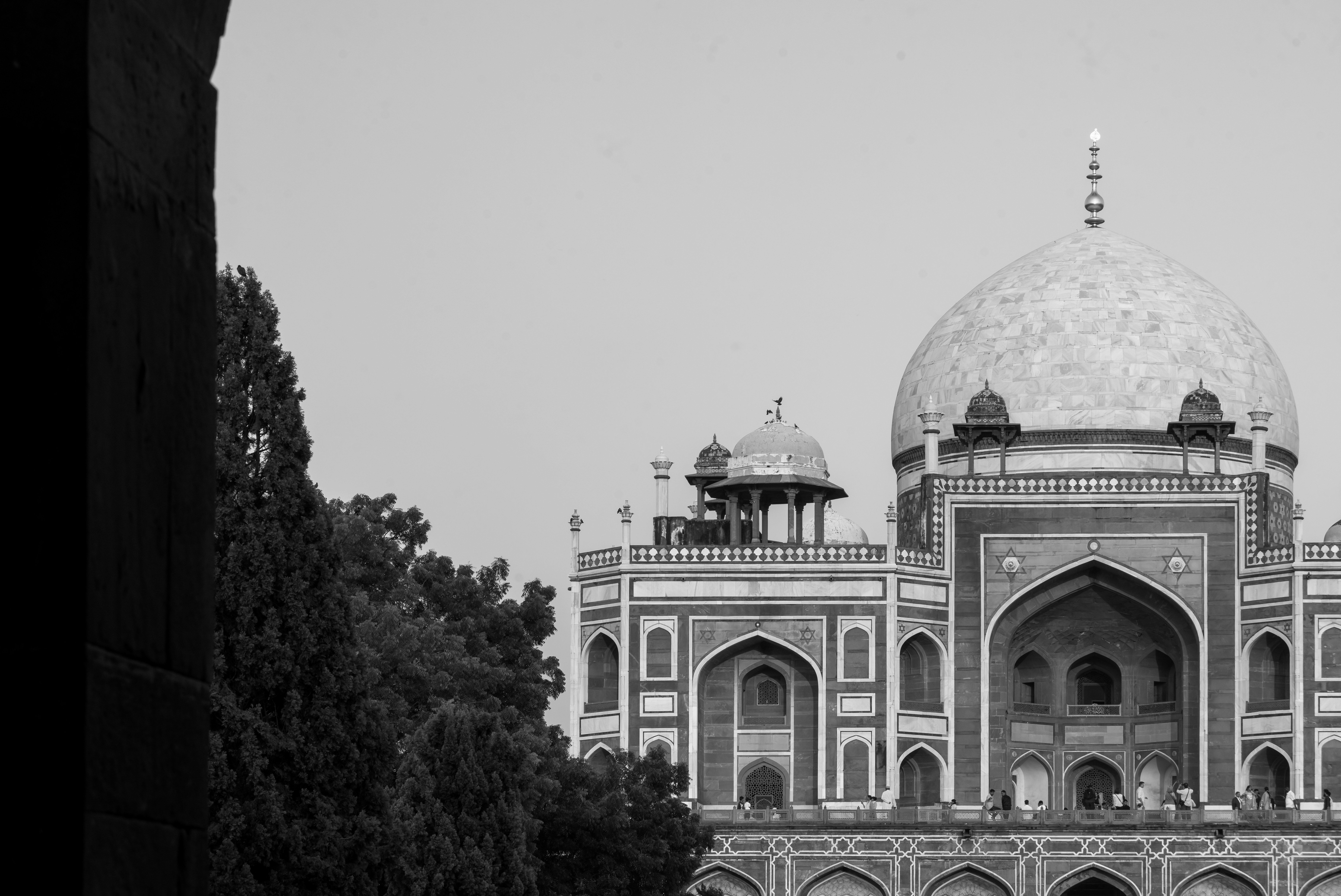 Humayun's Tomb is a UNESCO World Heritage site in Delhi, India, built for the Mughal Emperor Humayun by his widow, Bega Begam (Haji Begam), in the 1560s. The tomb is an early and magnificent example of Mughal architecture, featuring a Persian-inspired charbagh garden design and is noted as a precursor to the Taj Mahal. It is located near the Nizamuddin Dargah and was constructed by Persian architects Mirak Mirza Ghiyath and his son, Sayyid Muhammad.