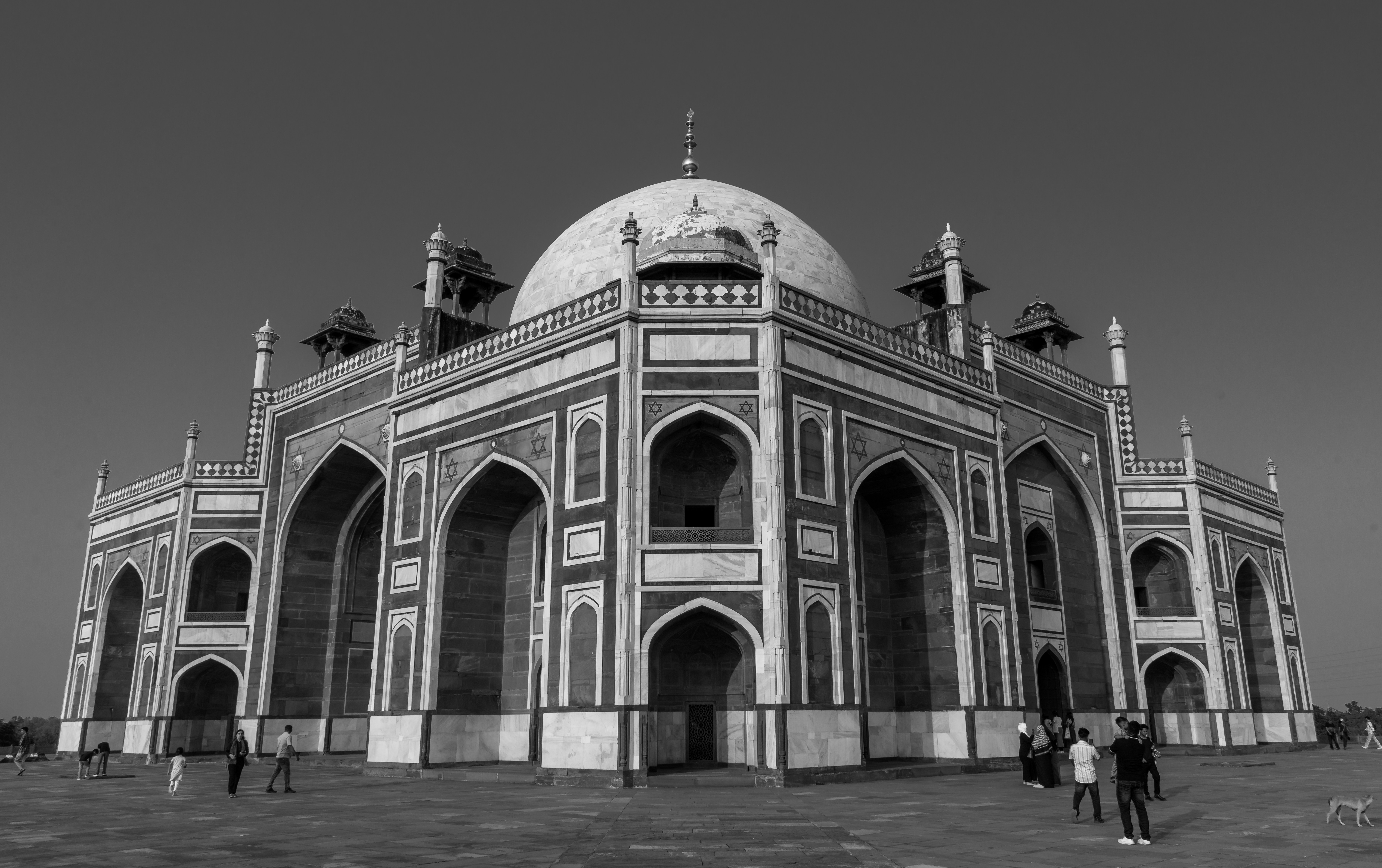 Humayun's Tomb is a UNESCO World Heritage site in Delhi, India, built for the Mughal Emperor Humayun by his widow, Bega Begam (Haji Begam), in the 1560s. The tomb is an early and magnificent example of Mughal architecture, featuring a Persian-inspired charbagh garden design and is noted as a precursor to the Taj Mahal. It is located near the Nizamuddin Dargah and was constructed by Persian architects Mirak Mirza Ghiyath and his son, Sayyid Muhammad.