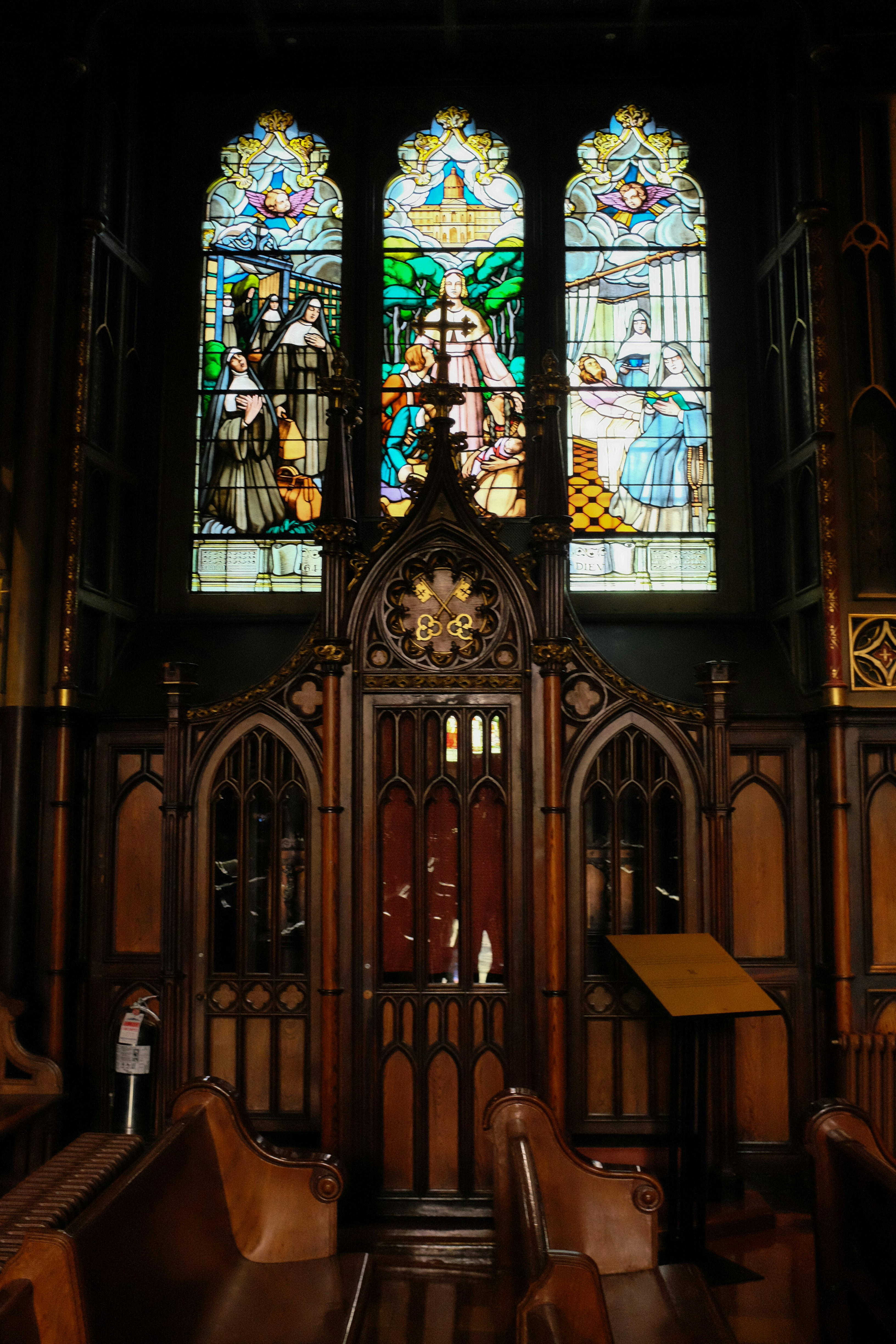 Glow in the Nave: Central Stained-Glass Above a Gothic Choir Screen