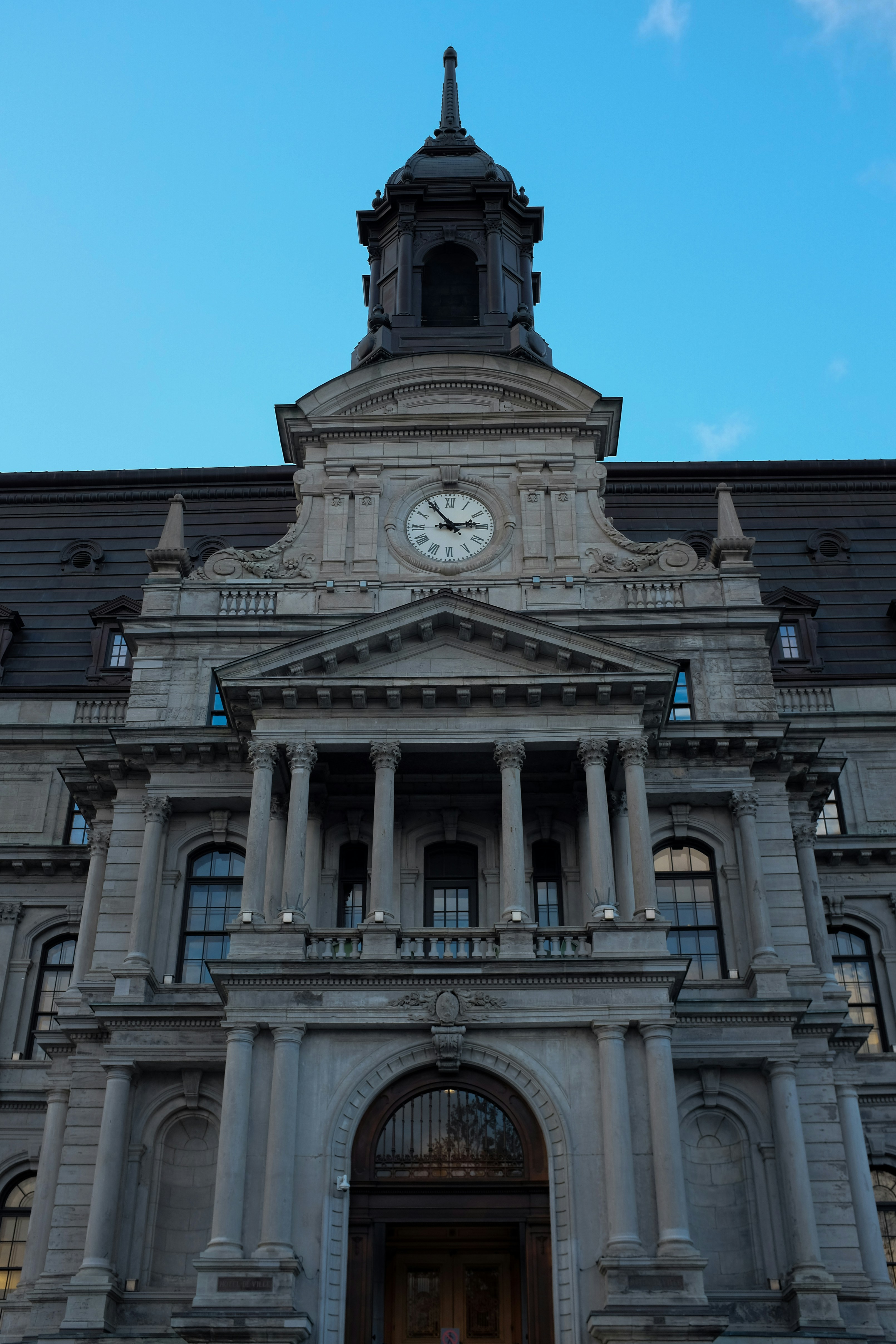 Stone Timekeeper: Symmetry and Clock on a Historic Facade