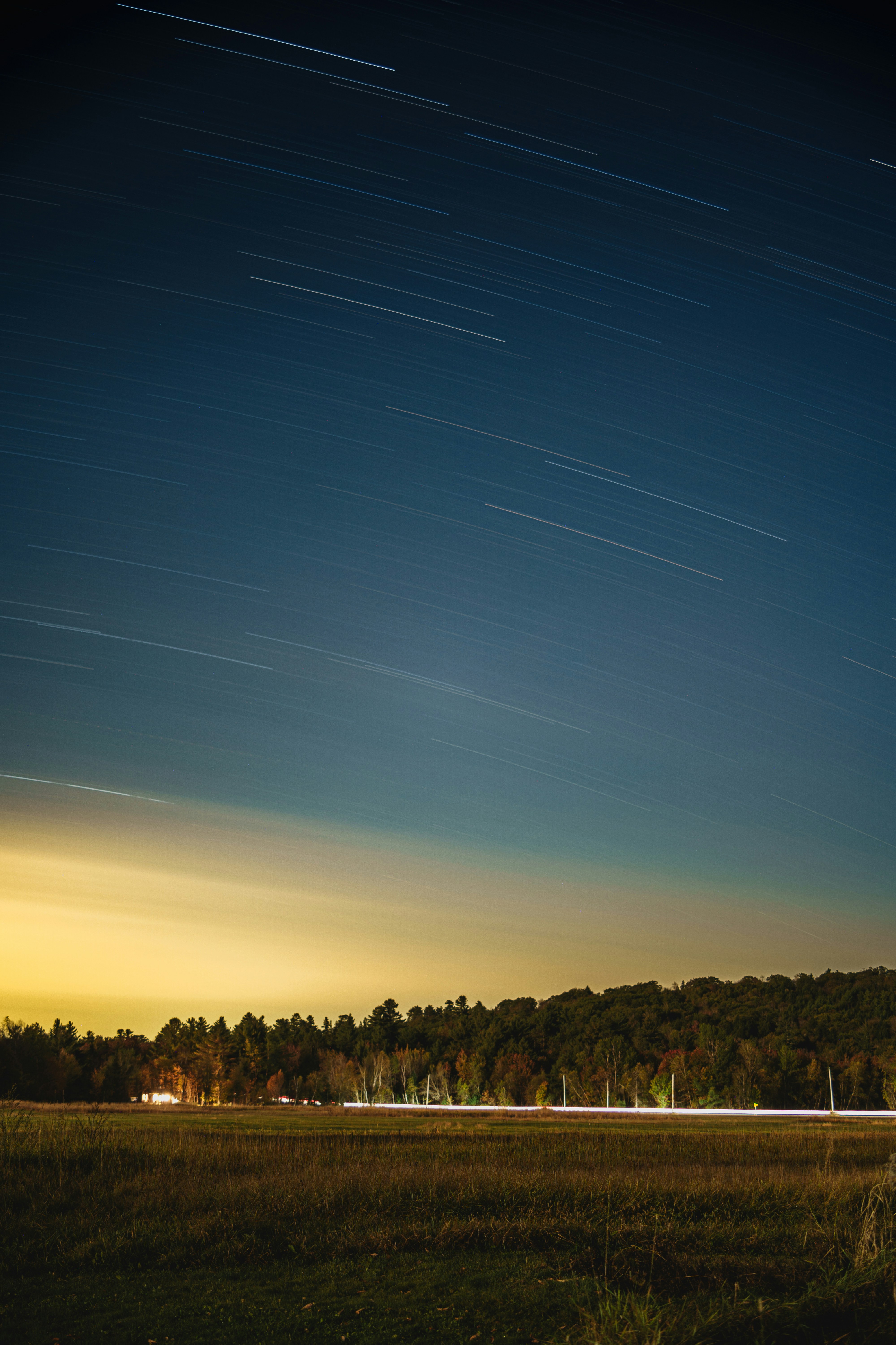 Star Trails Over a Quiet Field: A Long-Exposure Nightscape