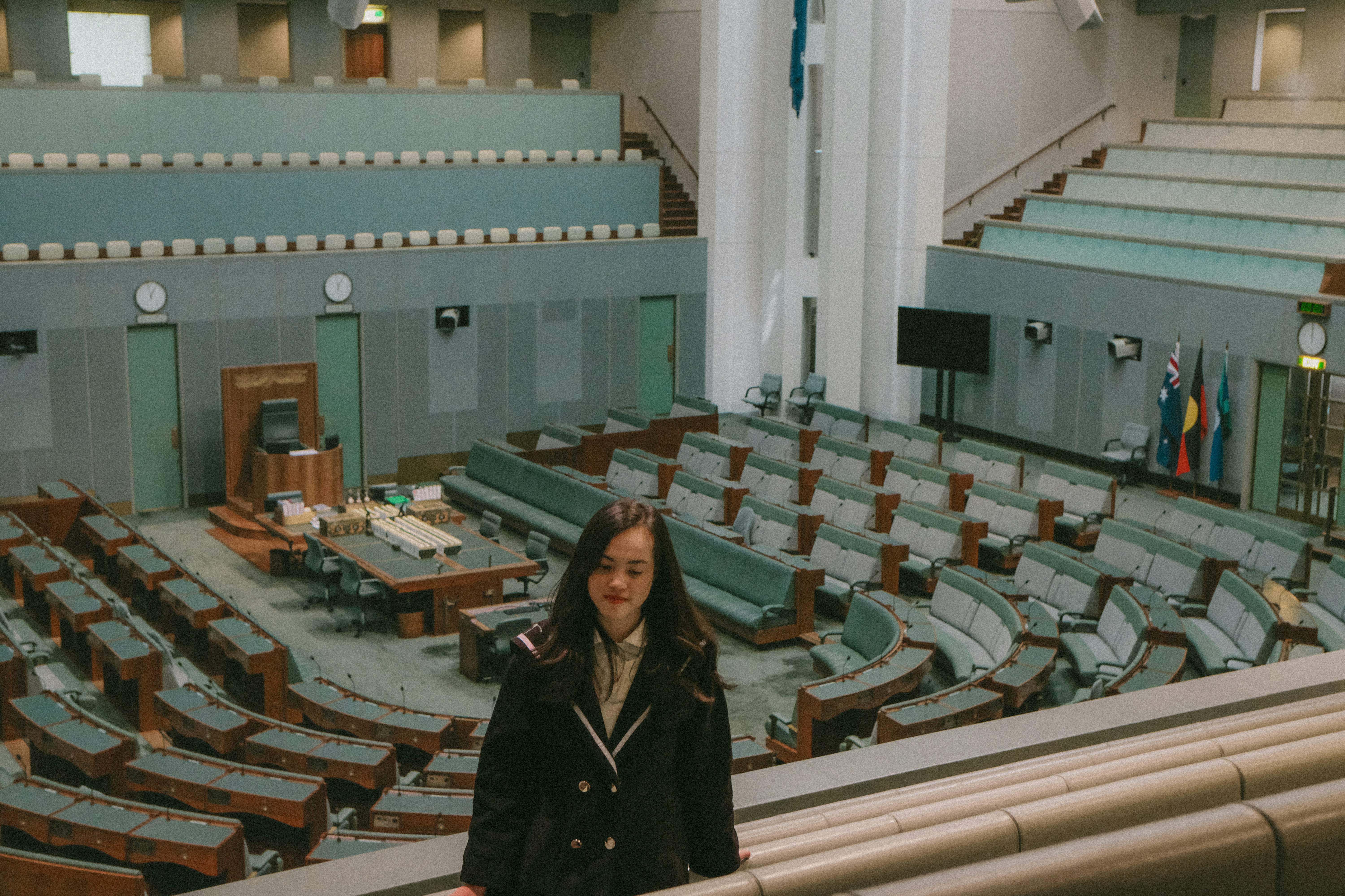 Woman stands in an empty parliament assembly hall. photo – Free ...