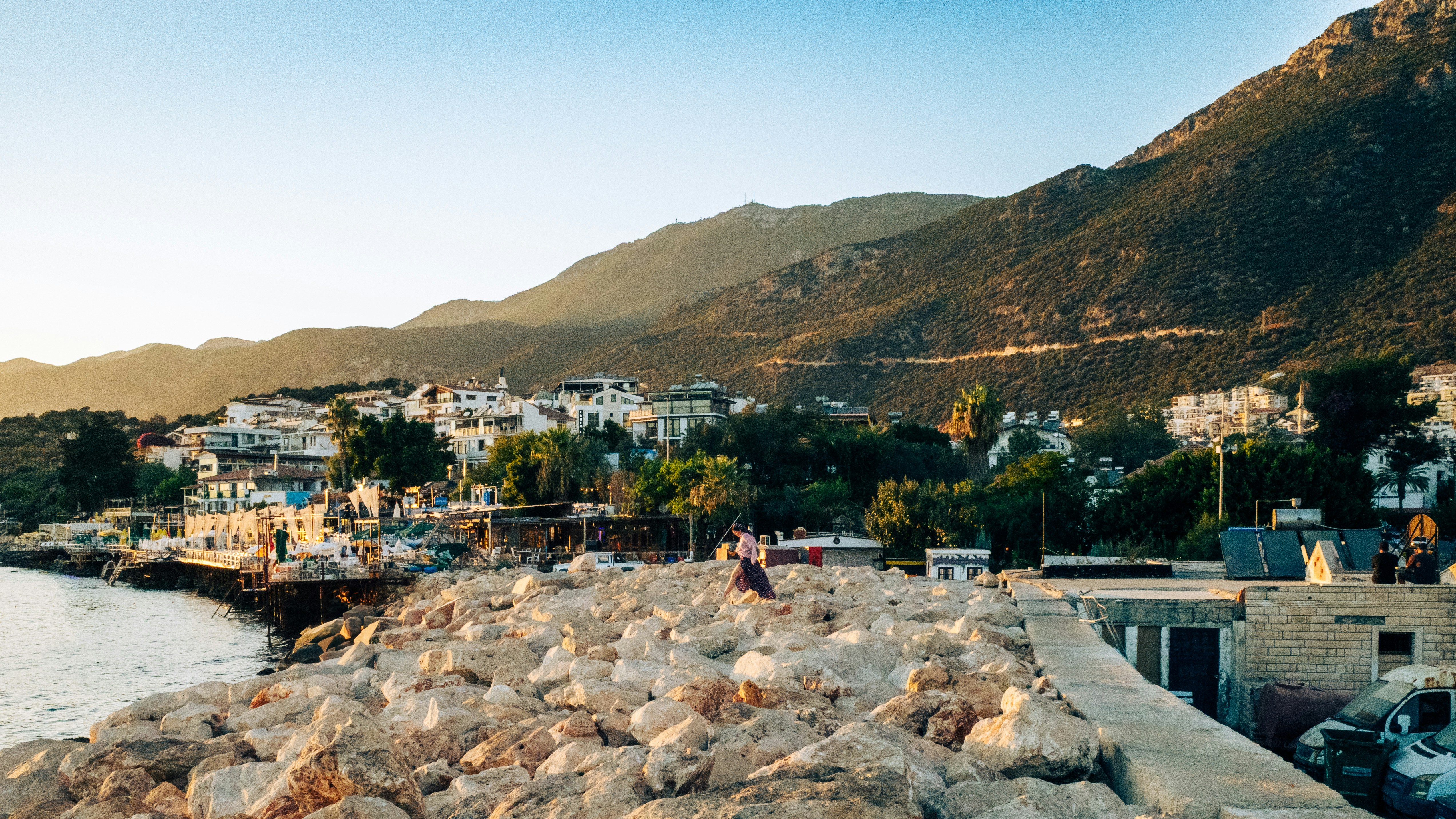 Harborronade at Dusk: Stones, Sea, and Subtle Town Lights