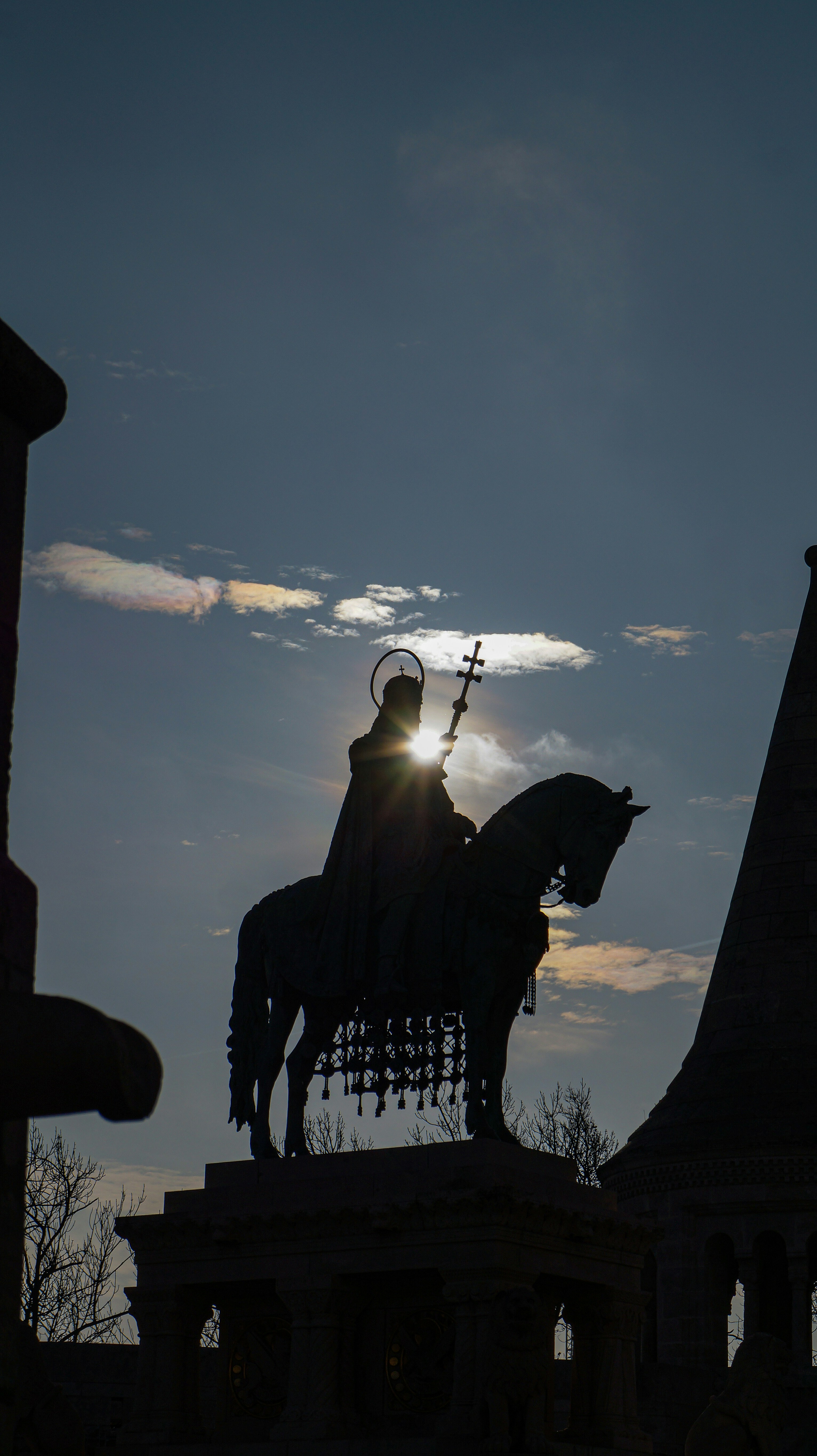 Haloed Rider on Horseback: A Backlit Monument Silhouette