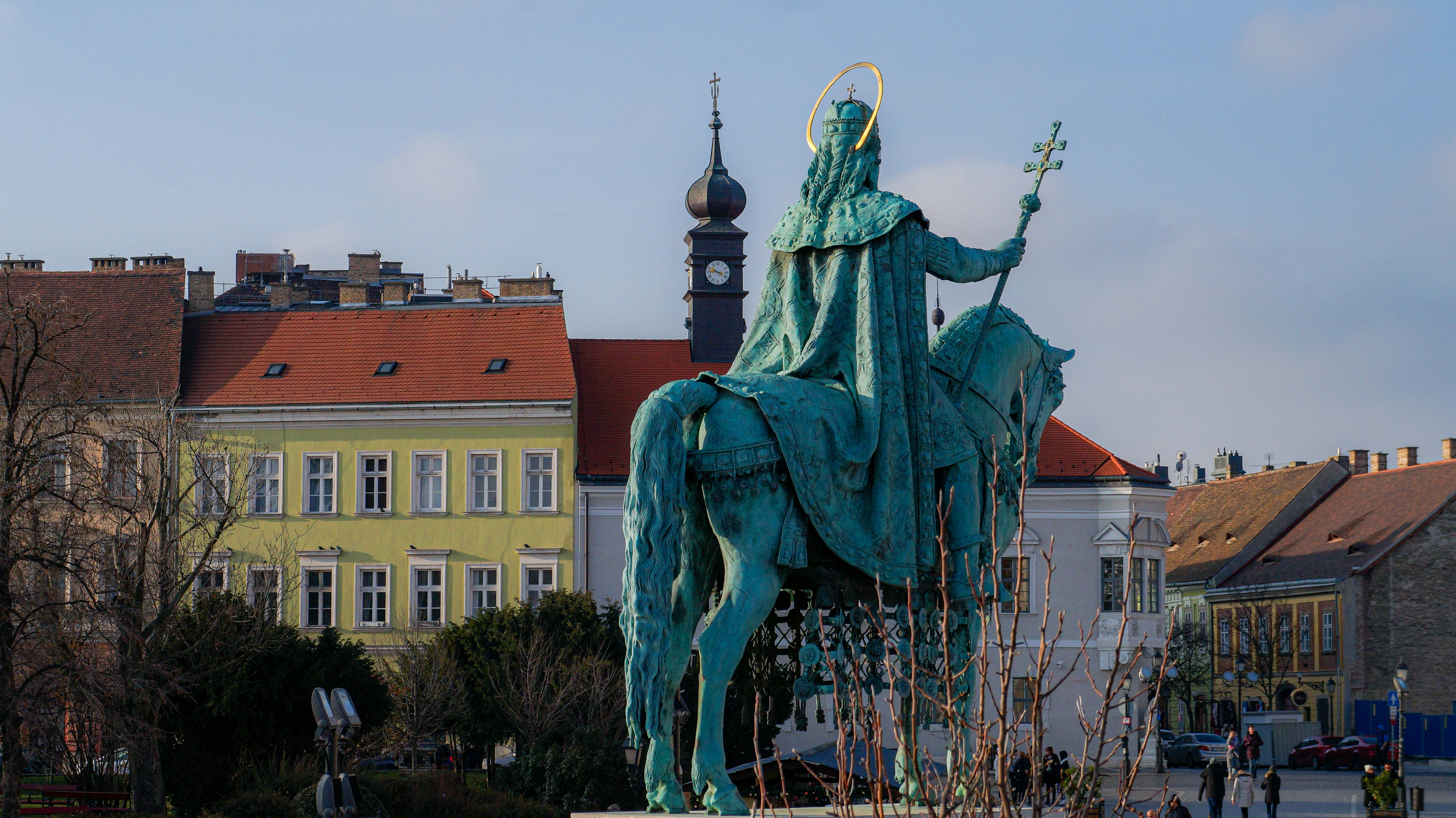 Emerald Guardian on Horseback Over a Pastel Town Square
