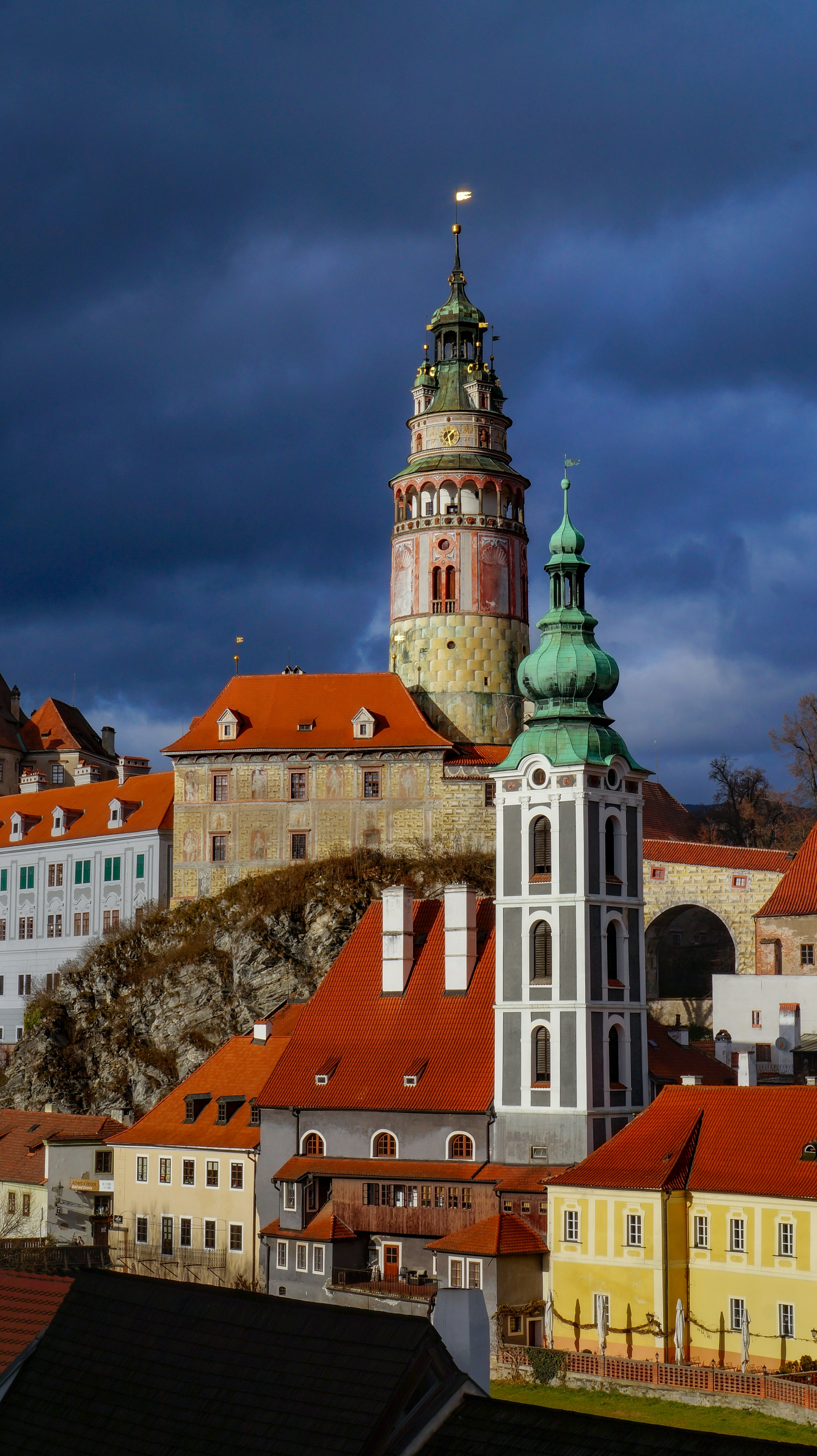 Historic castle tower and buildings under stormy sky.Luciani Koroshec