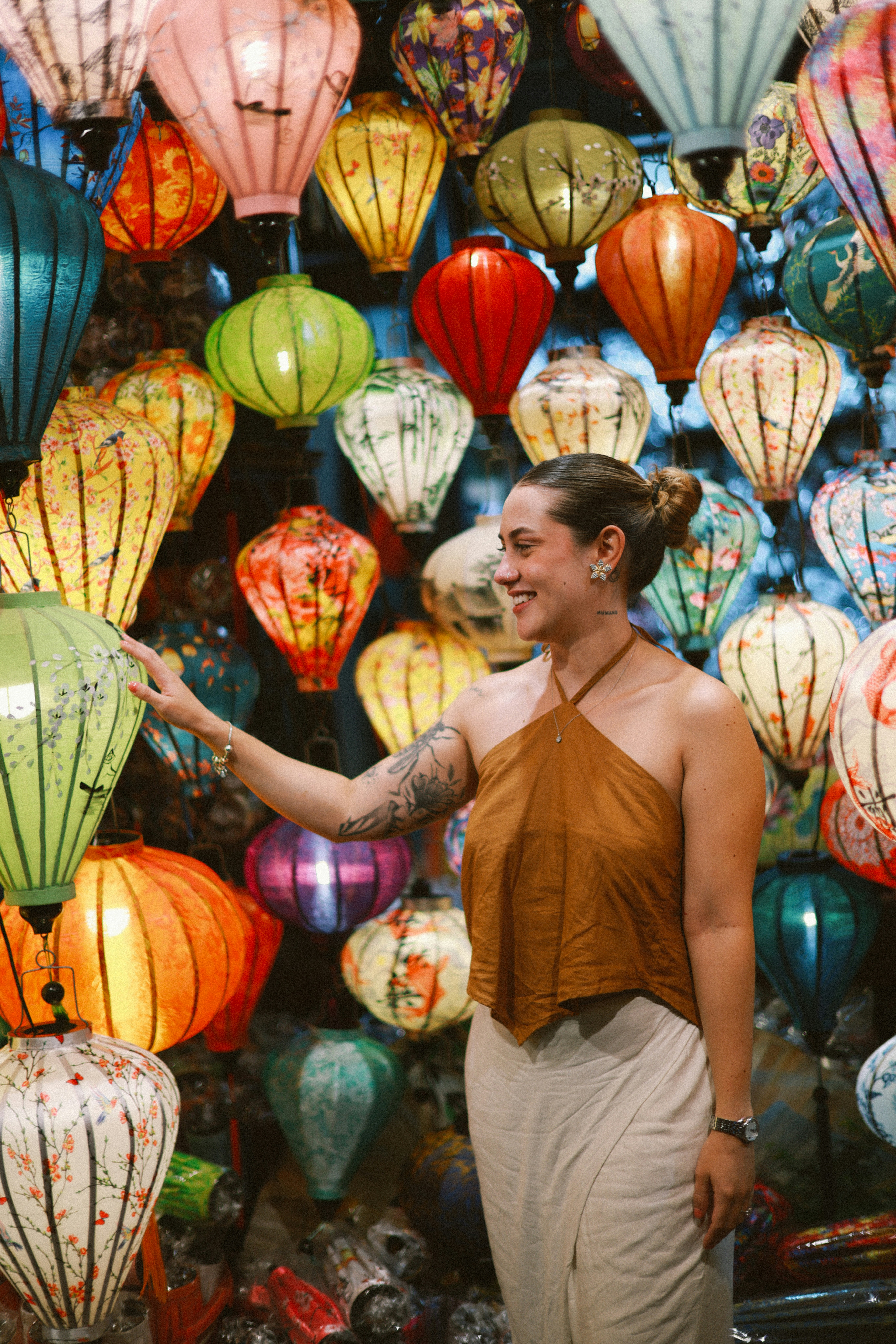 Lantern Corridor Portrait: A Woman’s Smile Beneath Floating Lights
