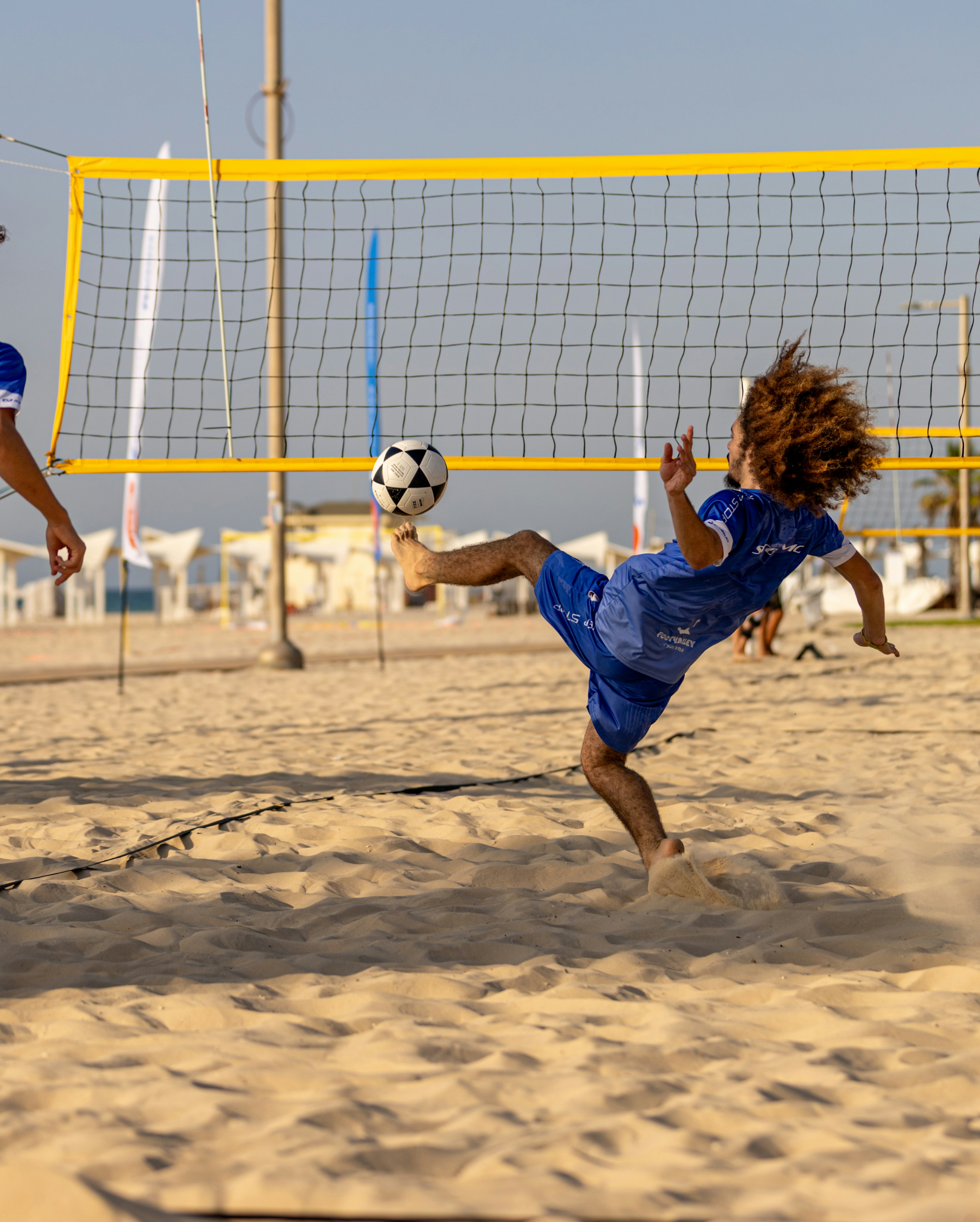 Volley on the Sand: A Duel at Golden Hour