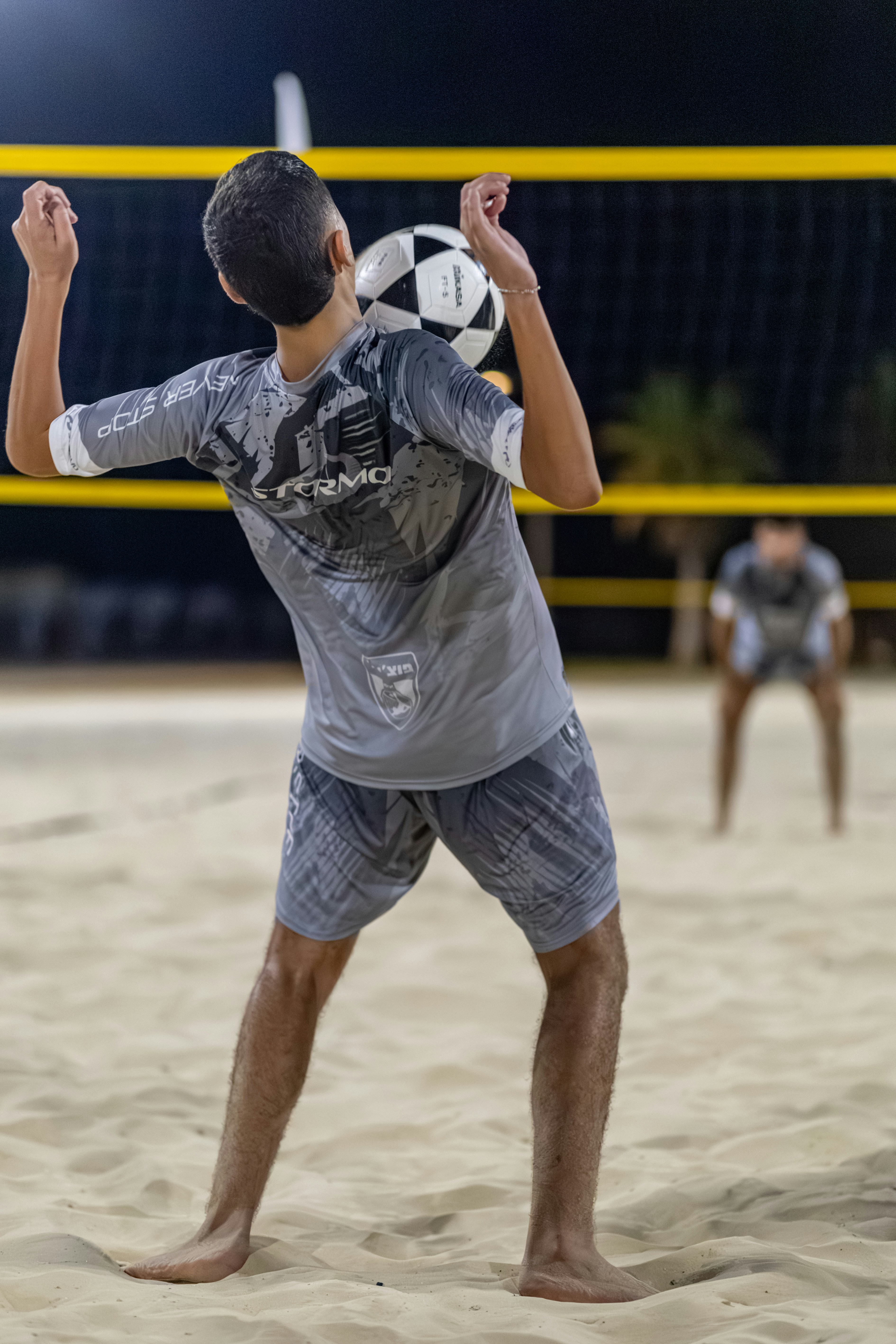 Mid‑Serving Volley: A Beach Volleyball Moment in Focus