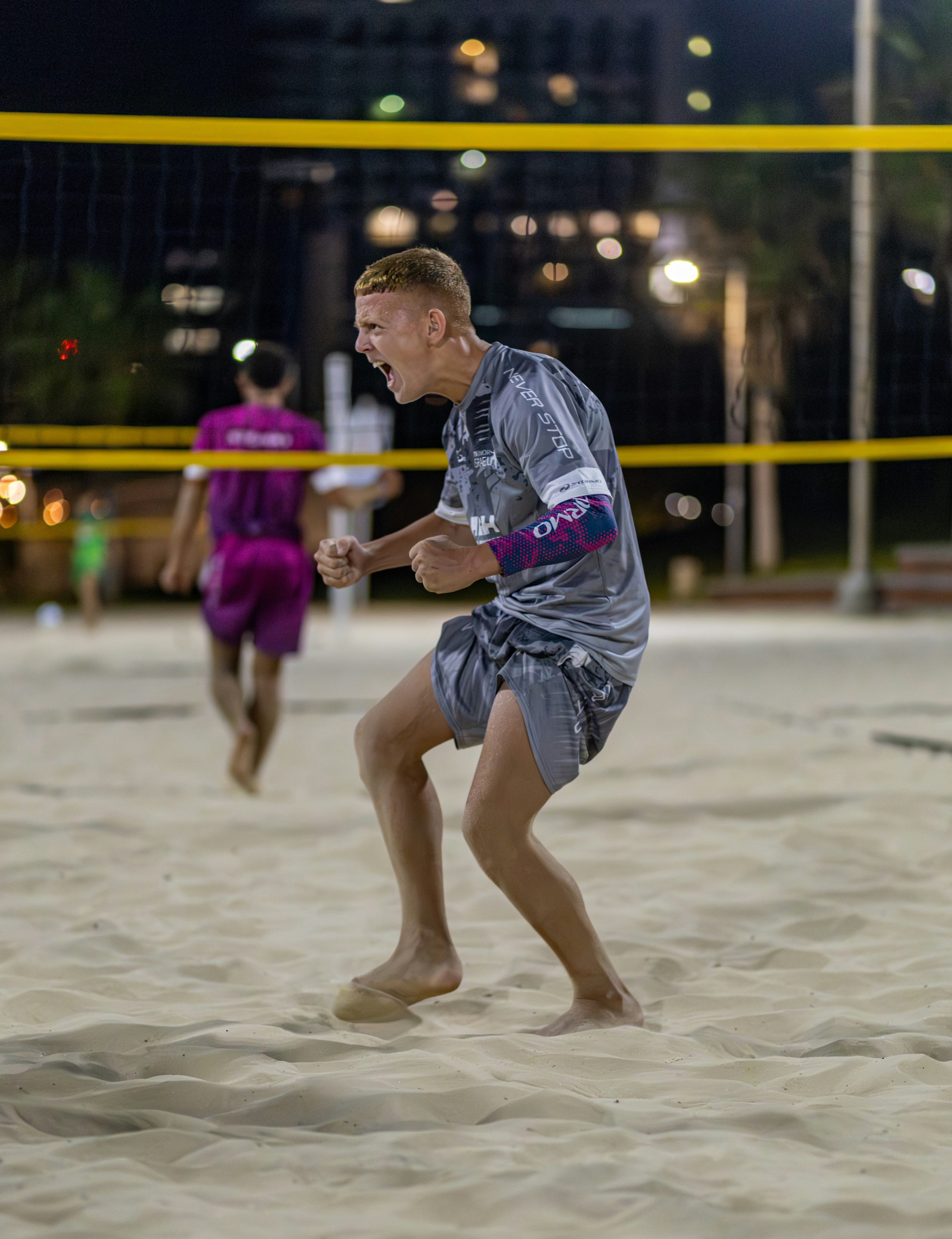 Mid-Serve Fury: A Beach Volleyball Moment in Motion