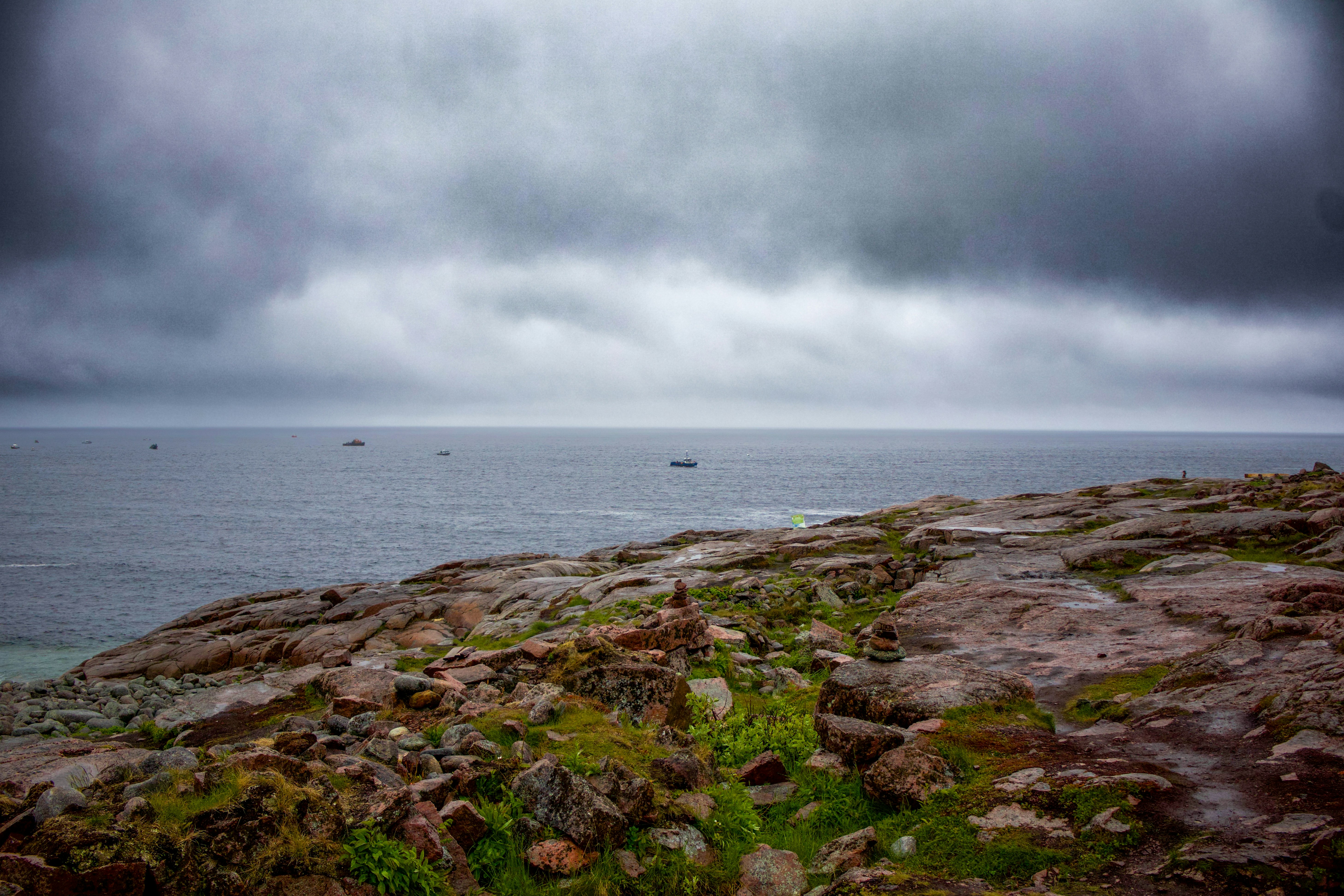 Rugged Mossy Granite at the Edge of a Stormy Sea