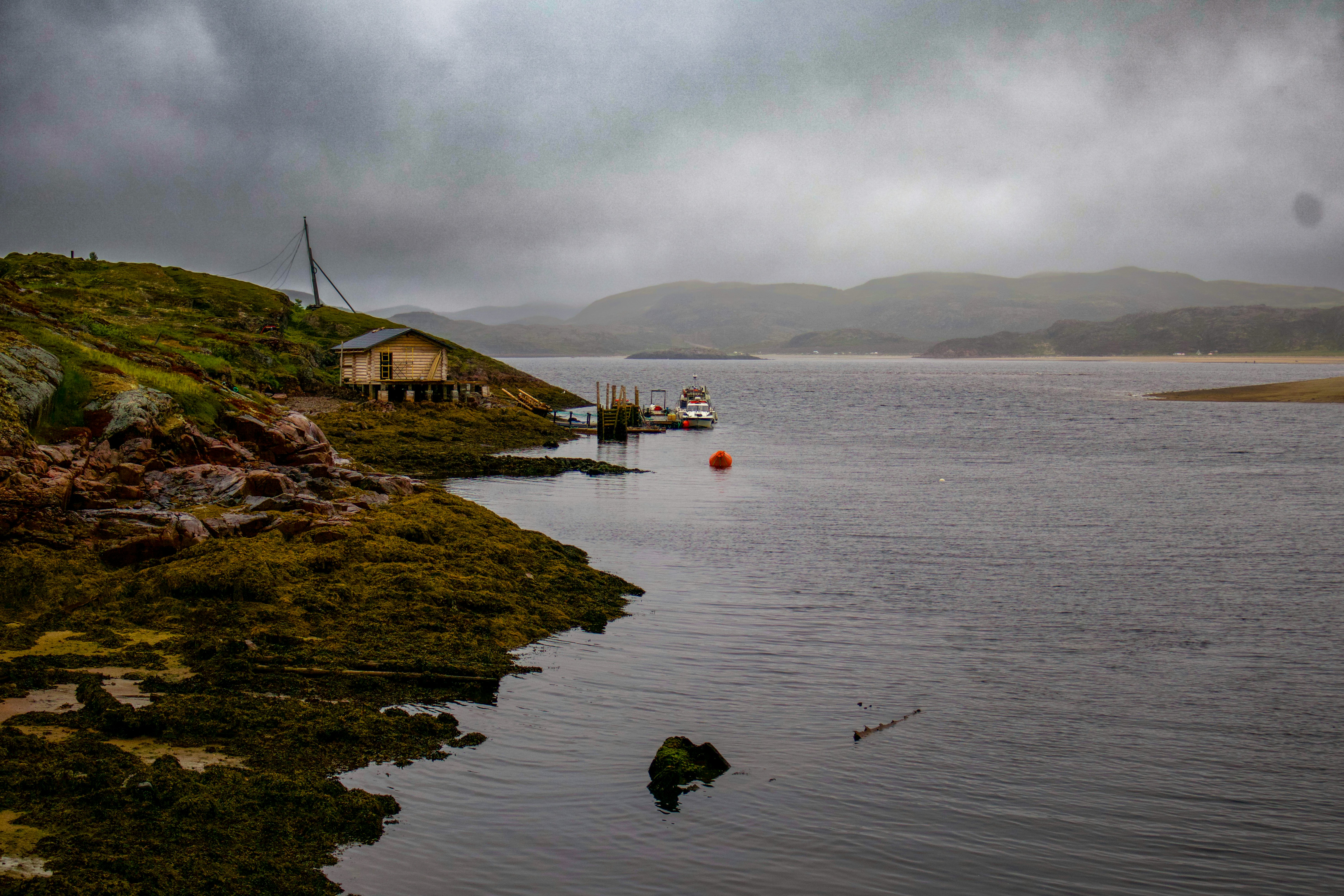 Harbor Shack at the Edge of a Quiet Channel